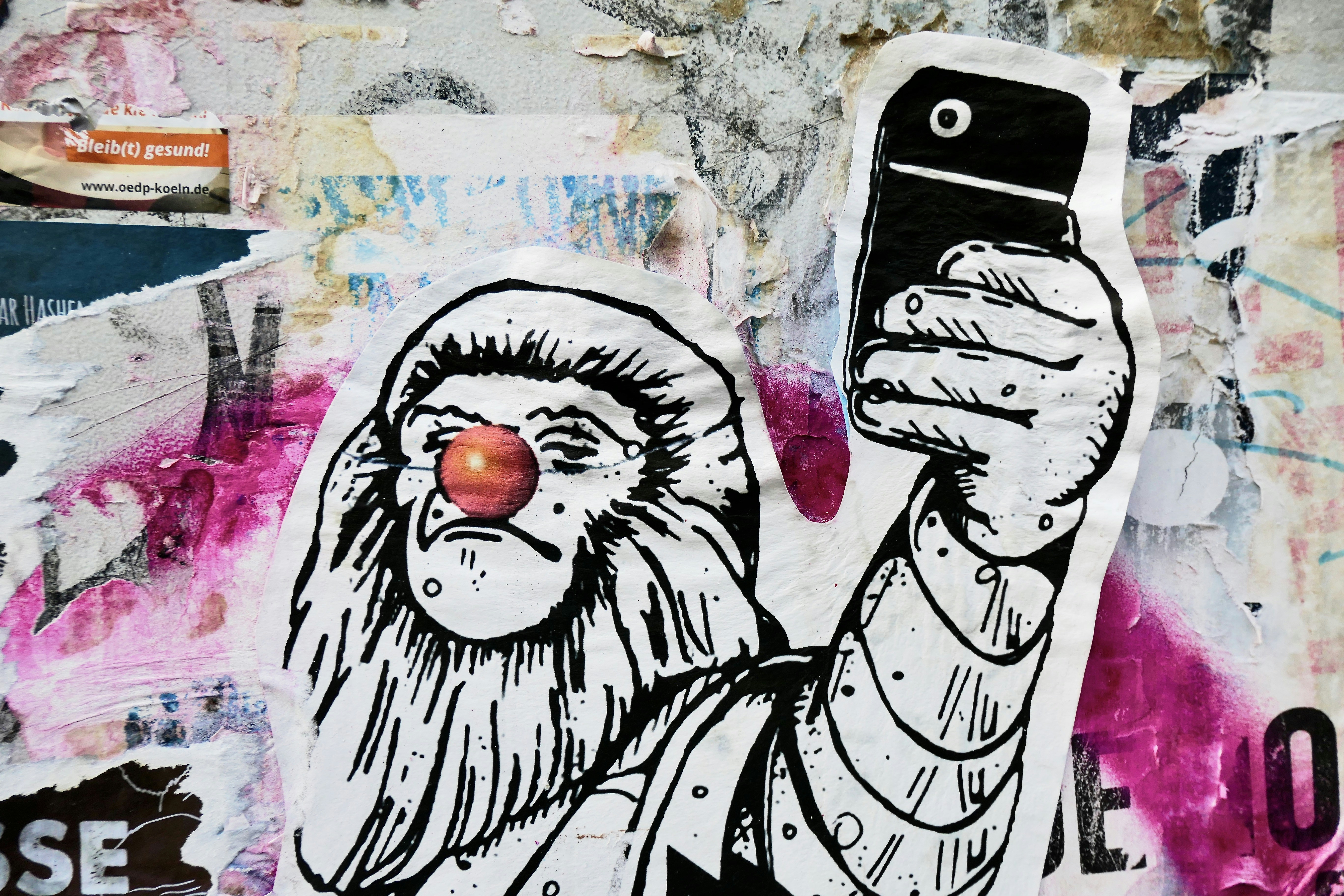 Sticker-style graffiti illustration of a bearded Santa taking a selfie with a smartphone, set against a chaotic collage of posters and paint.