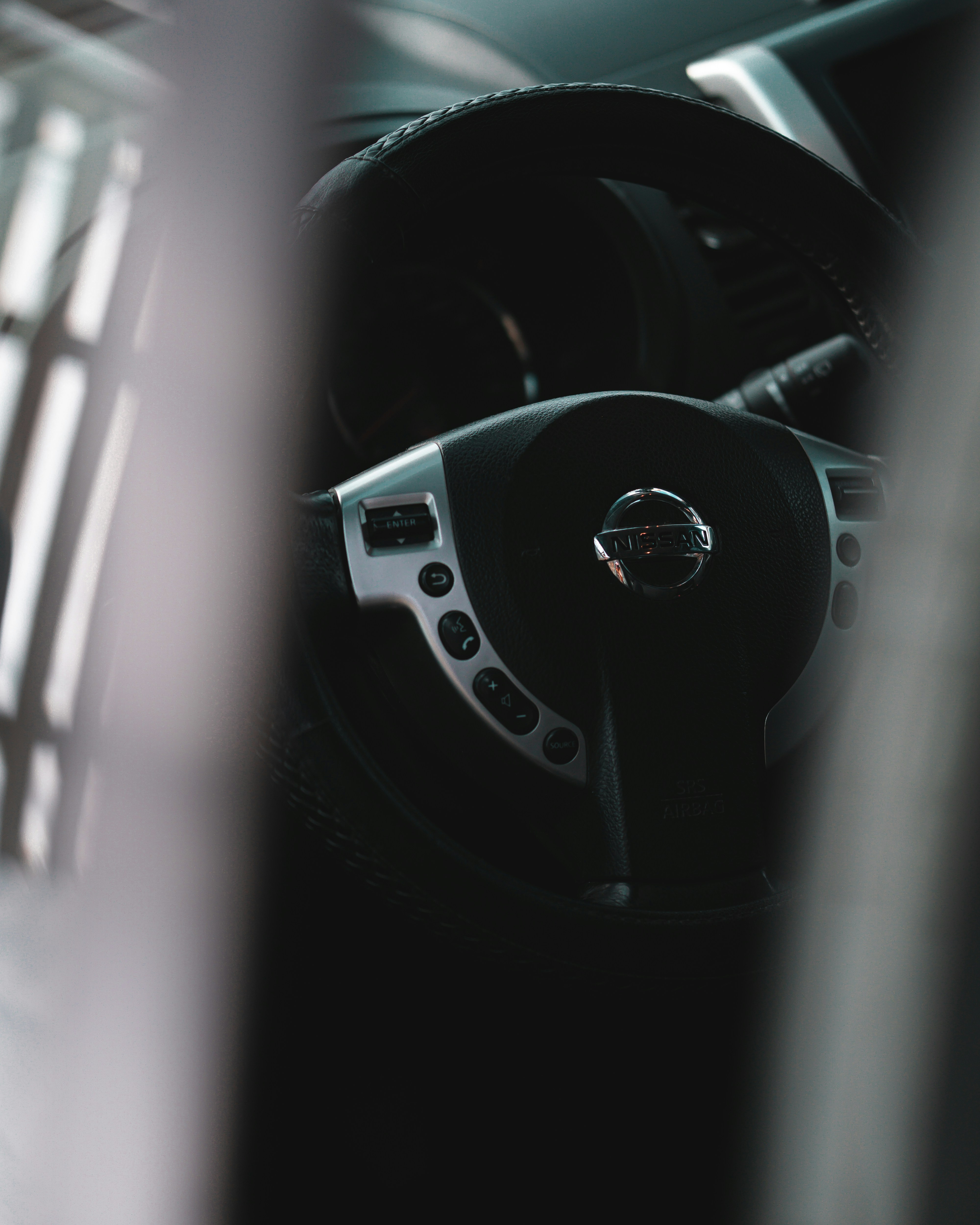 Centered Gaze: A Nissan Steering Wheel through a Subtle Car Interior