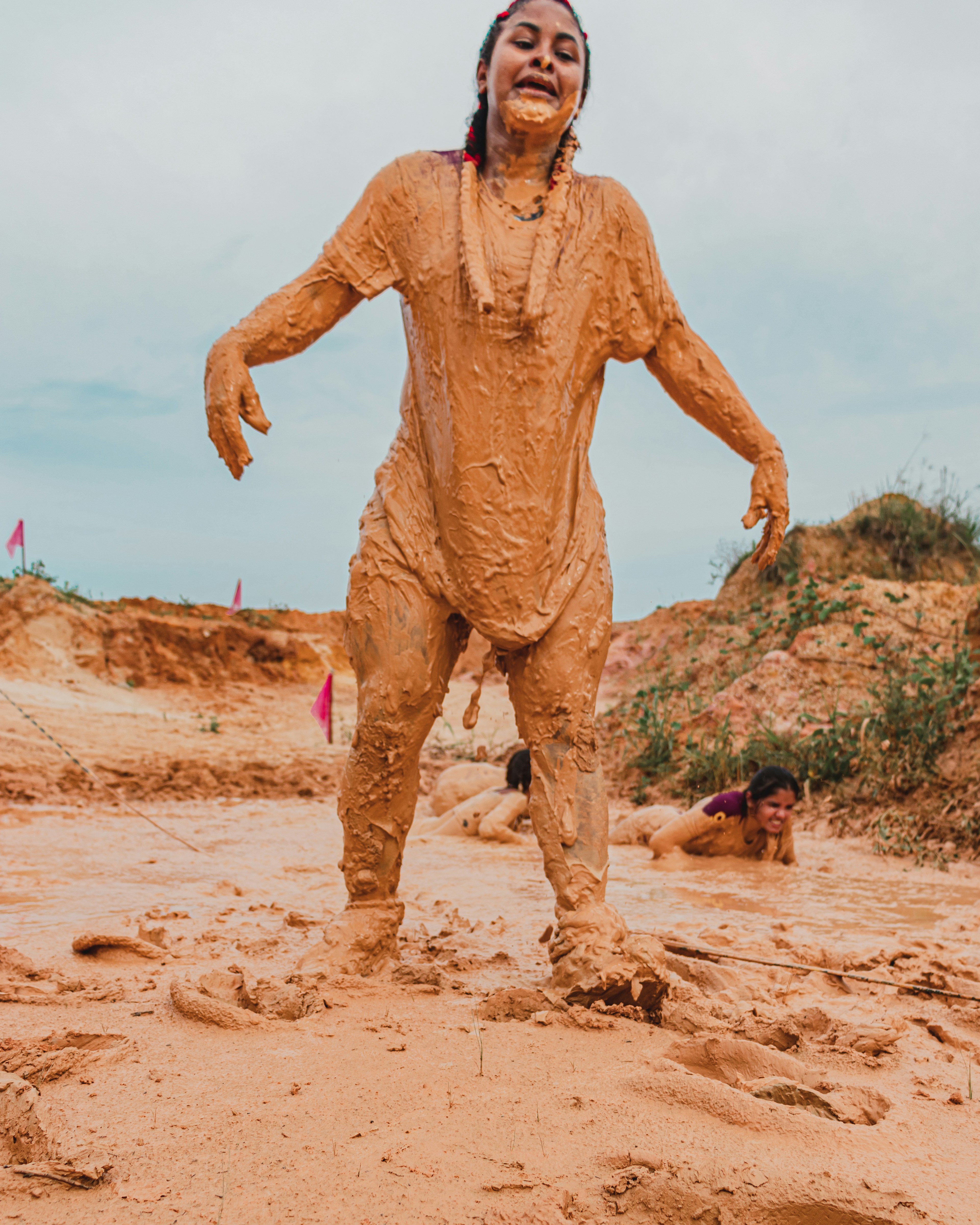 Mud-Sculpted Moment: A Confident Stance on Sunlit Clay Dunes
