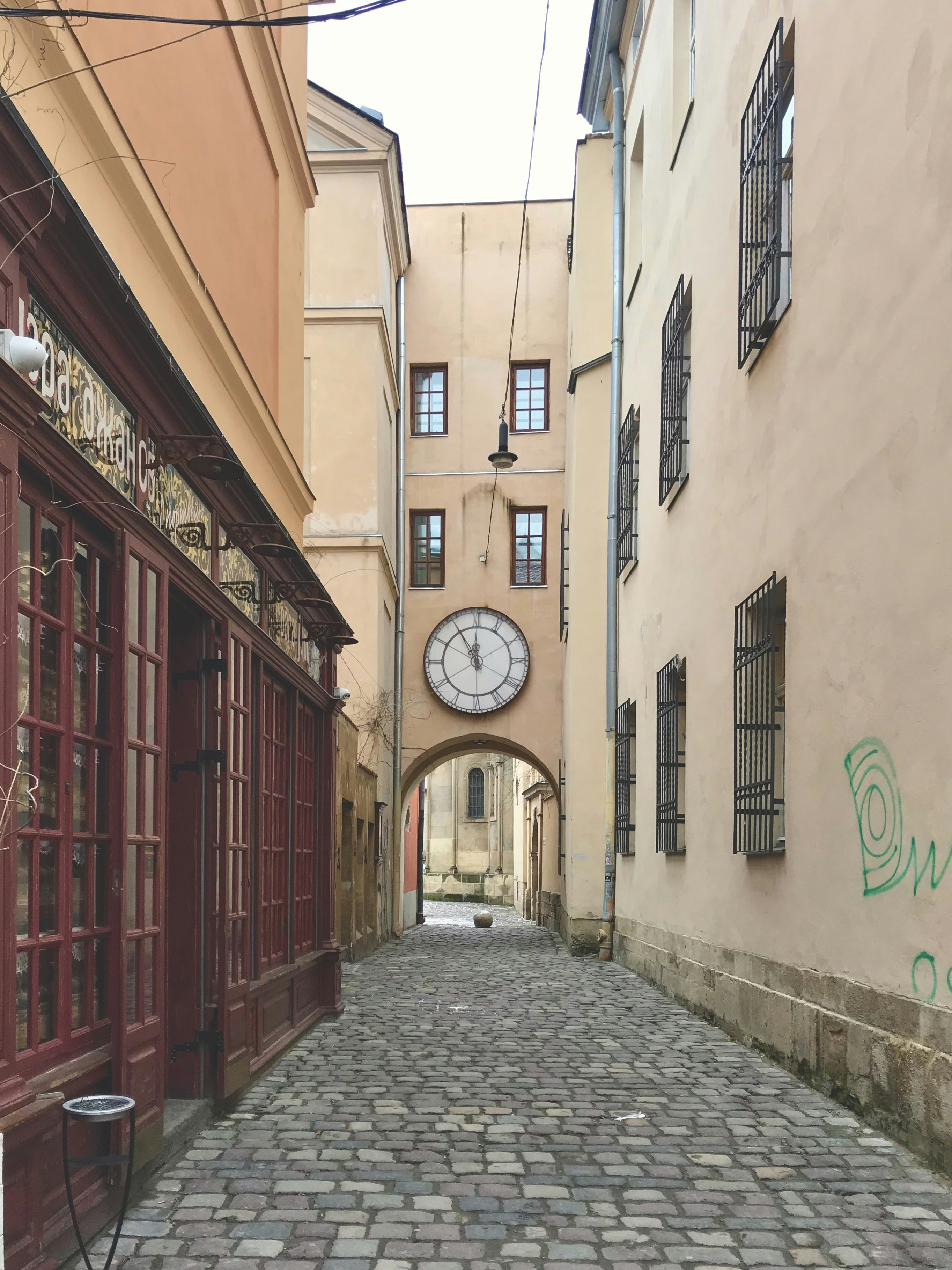 Clock Arches: A Cobblestone Corridor Toward Time
