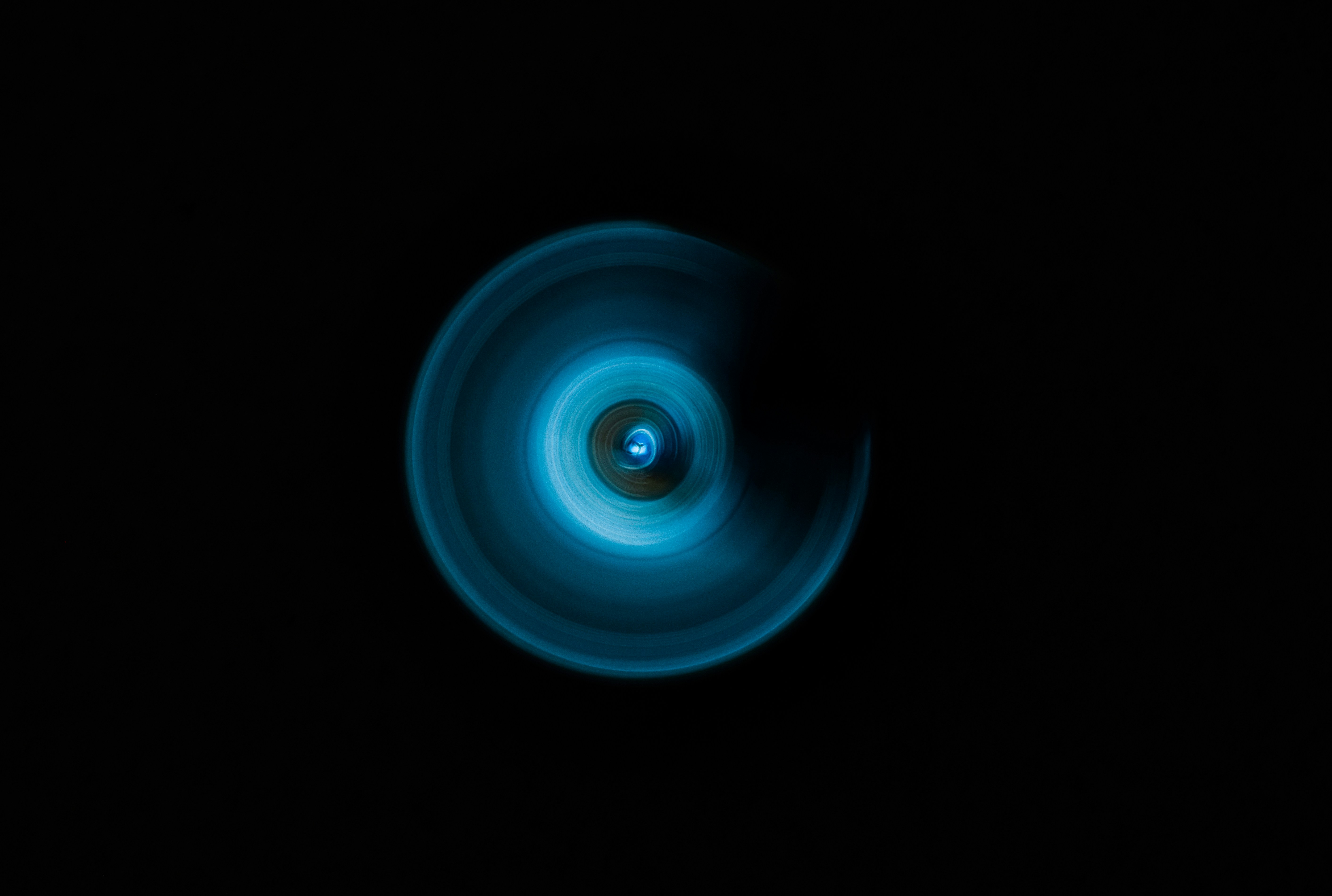 Neon Ring in the Dark: A Close-Up of a Camera Lens Glow