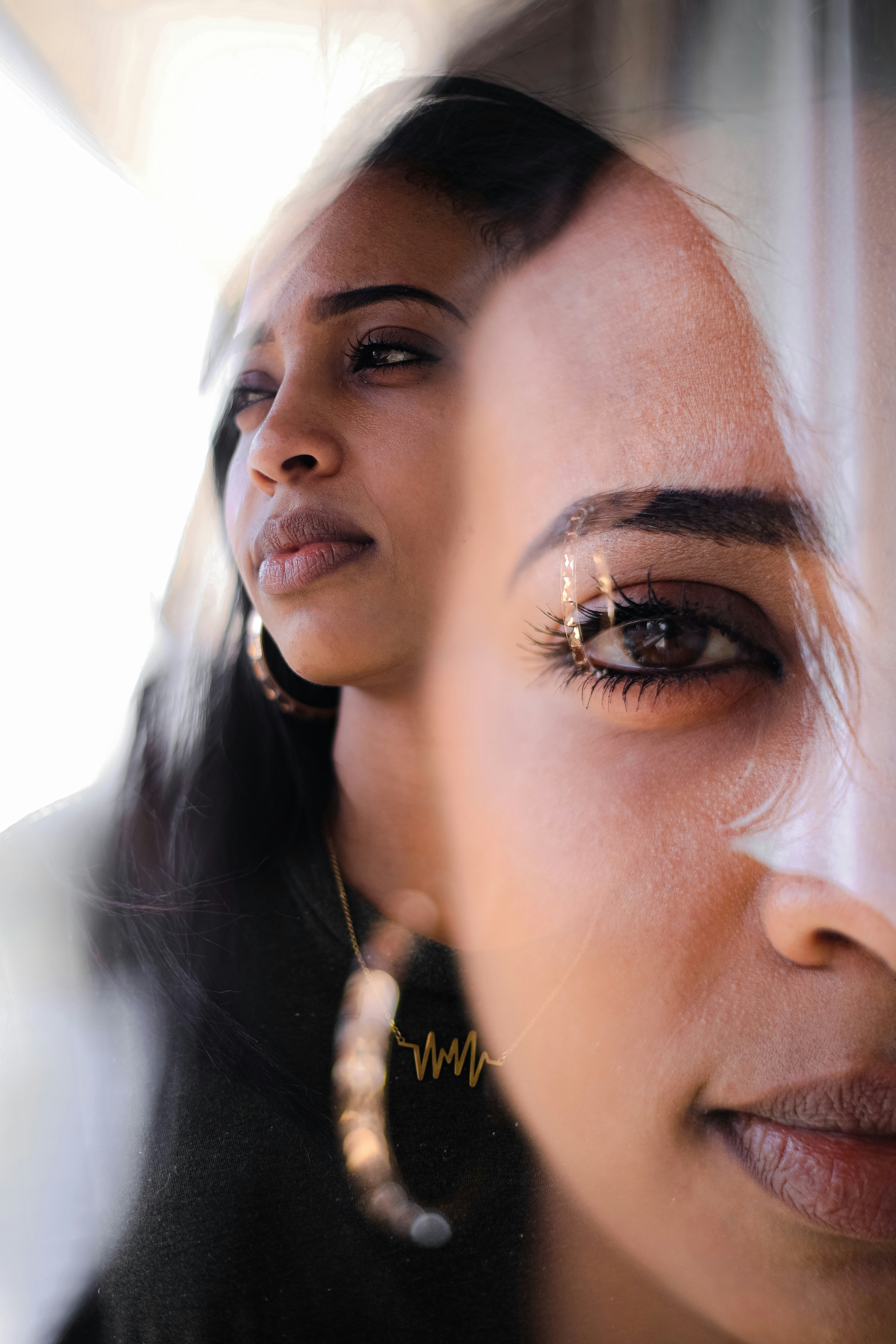 Veiled Gaze: A Dual-Exposure Portrait Through Sheer Fabric