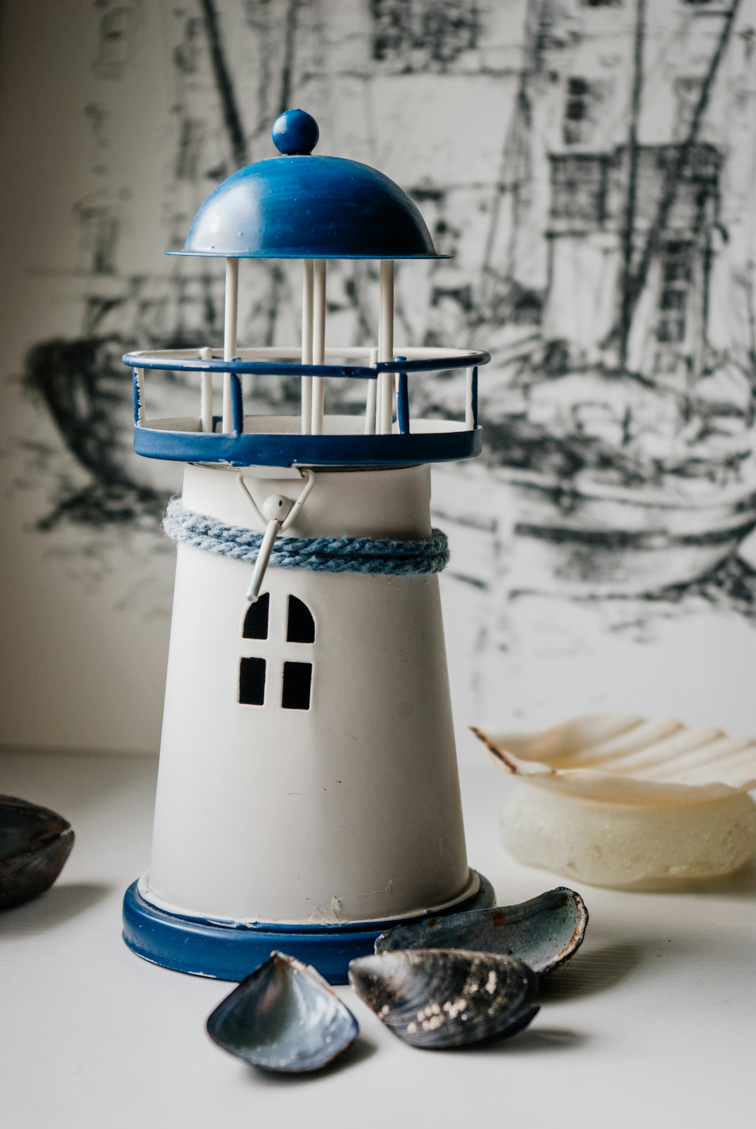 Cerulean Keeper: A Tiny Lighthouse Still Life in Studio Light