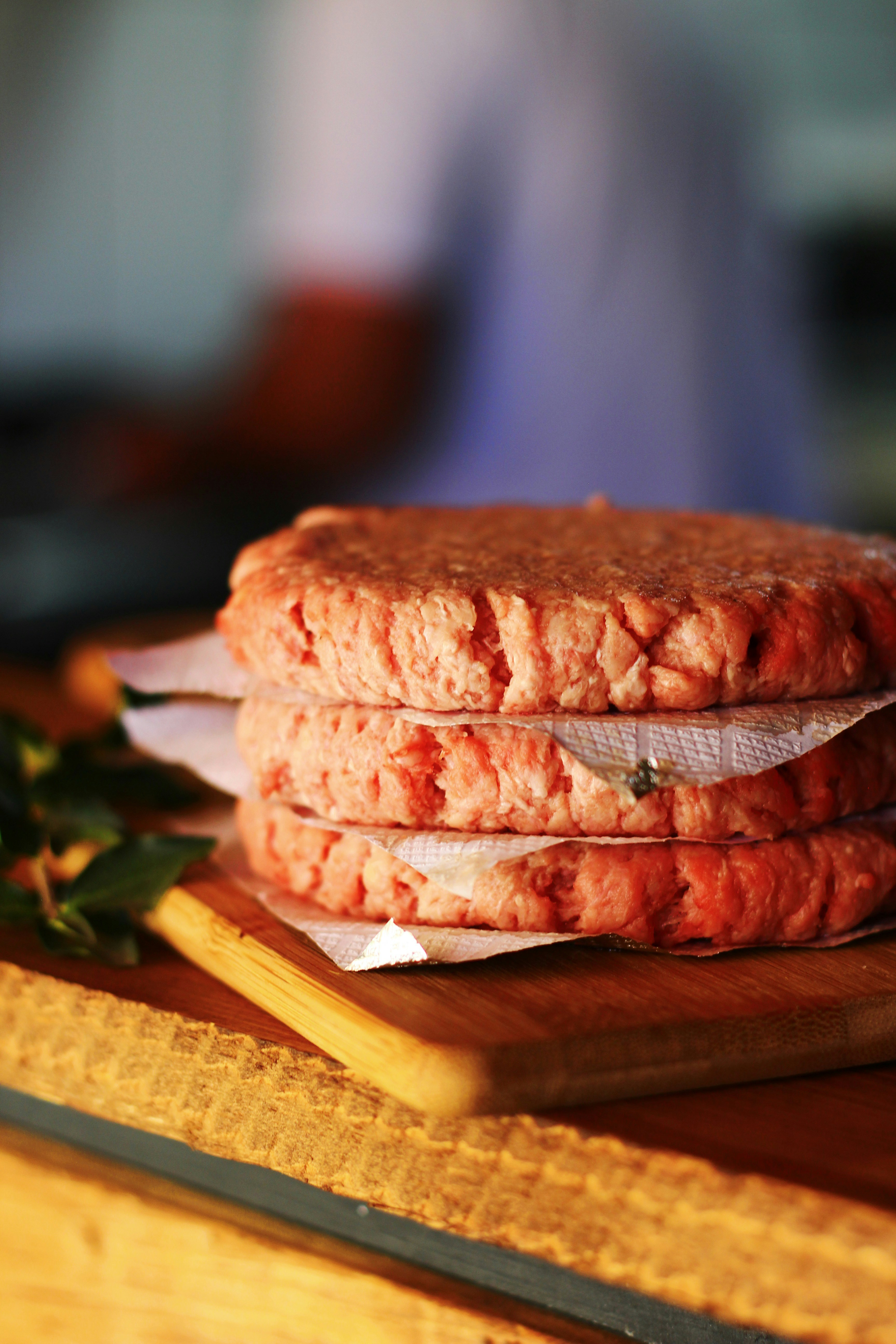 Stacked Chicken Patties on a Wooden Board