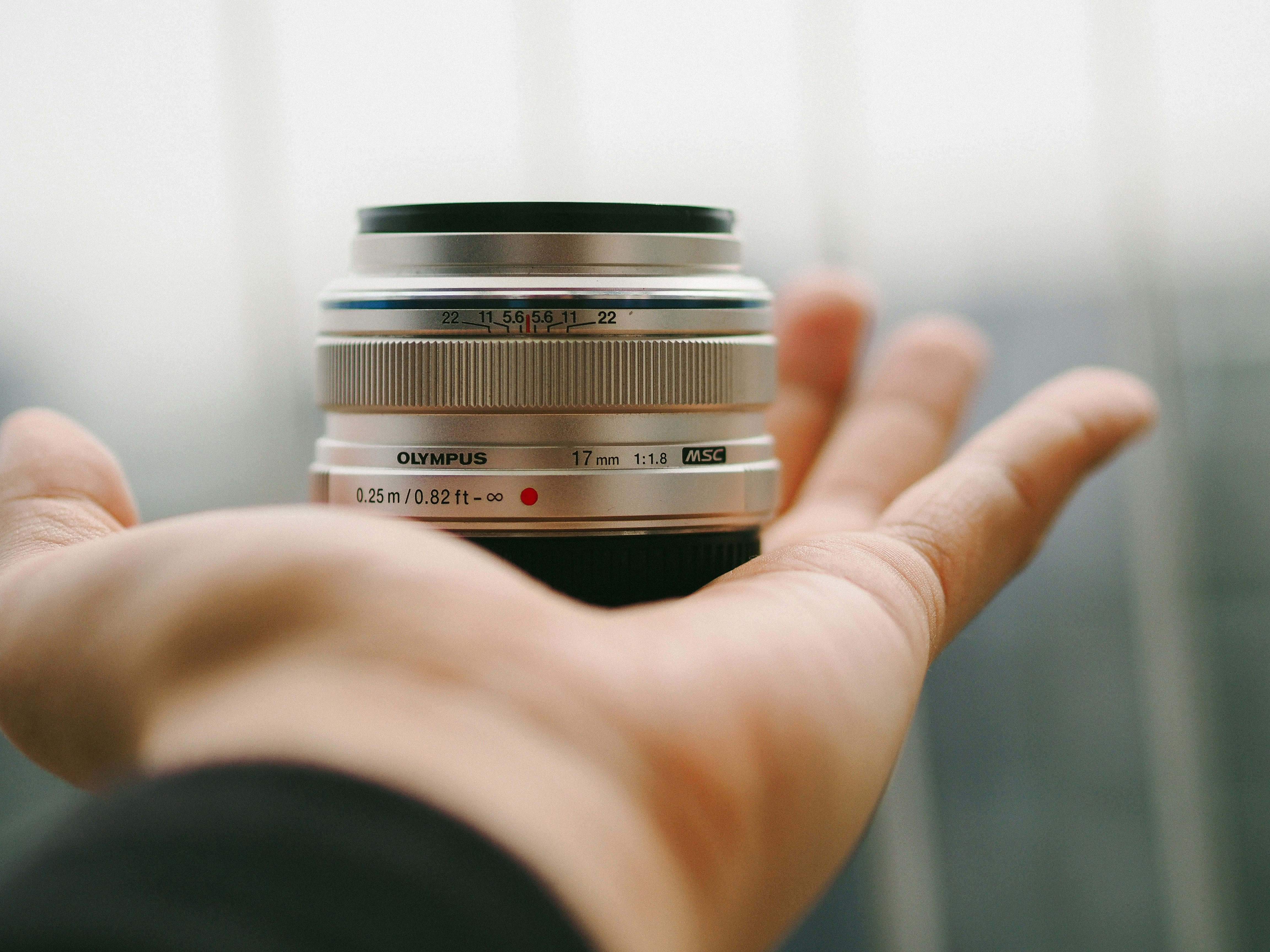 Person holding black and silver camera lens photo – Free Human Image on ...