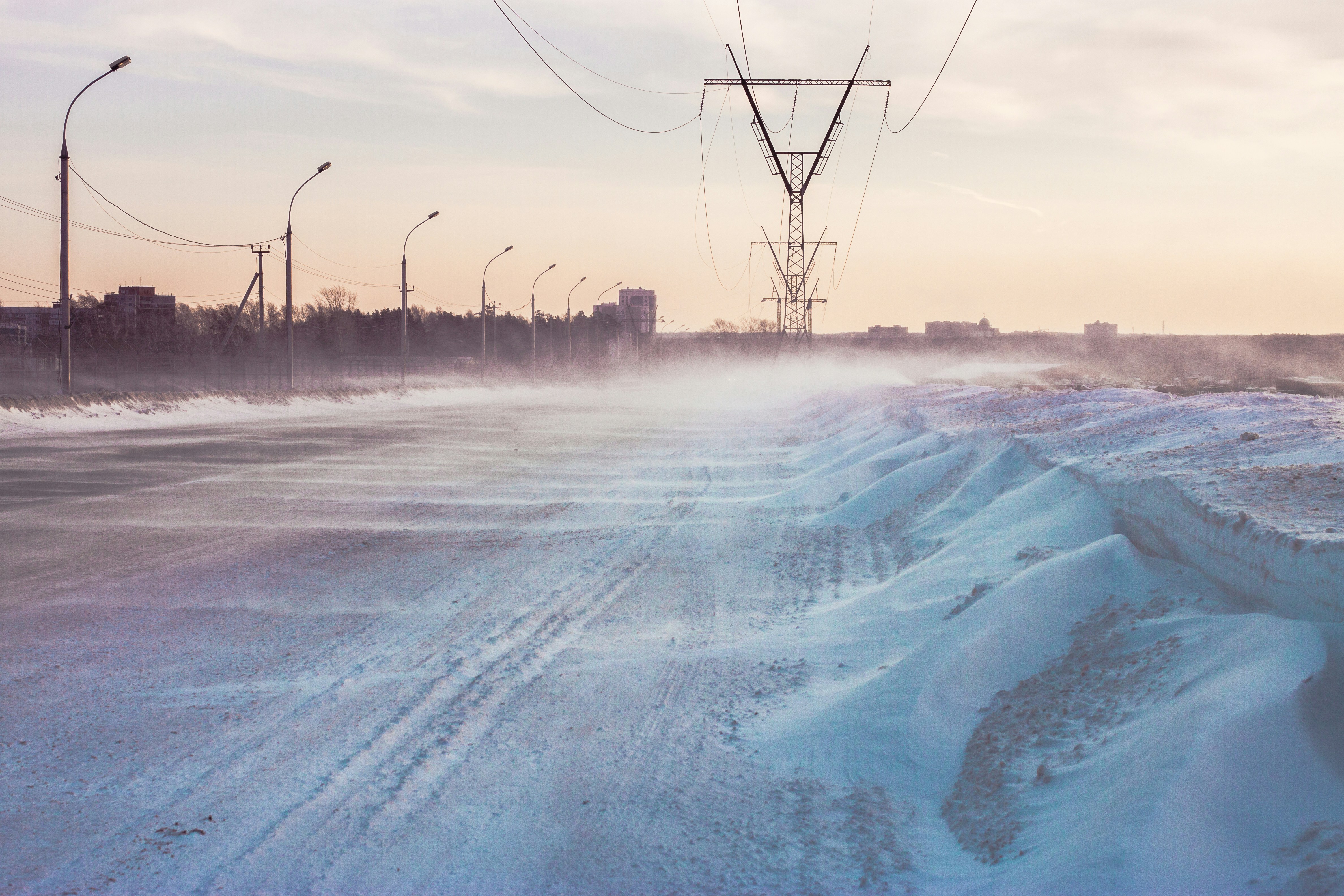 Dawn on the Frosted Road: Fog, Snow, and a Distant Transmission Tower