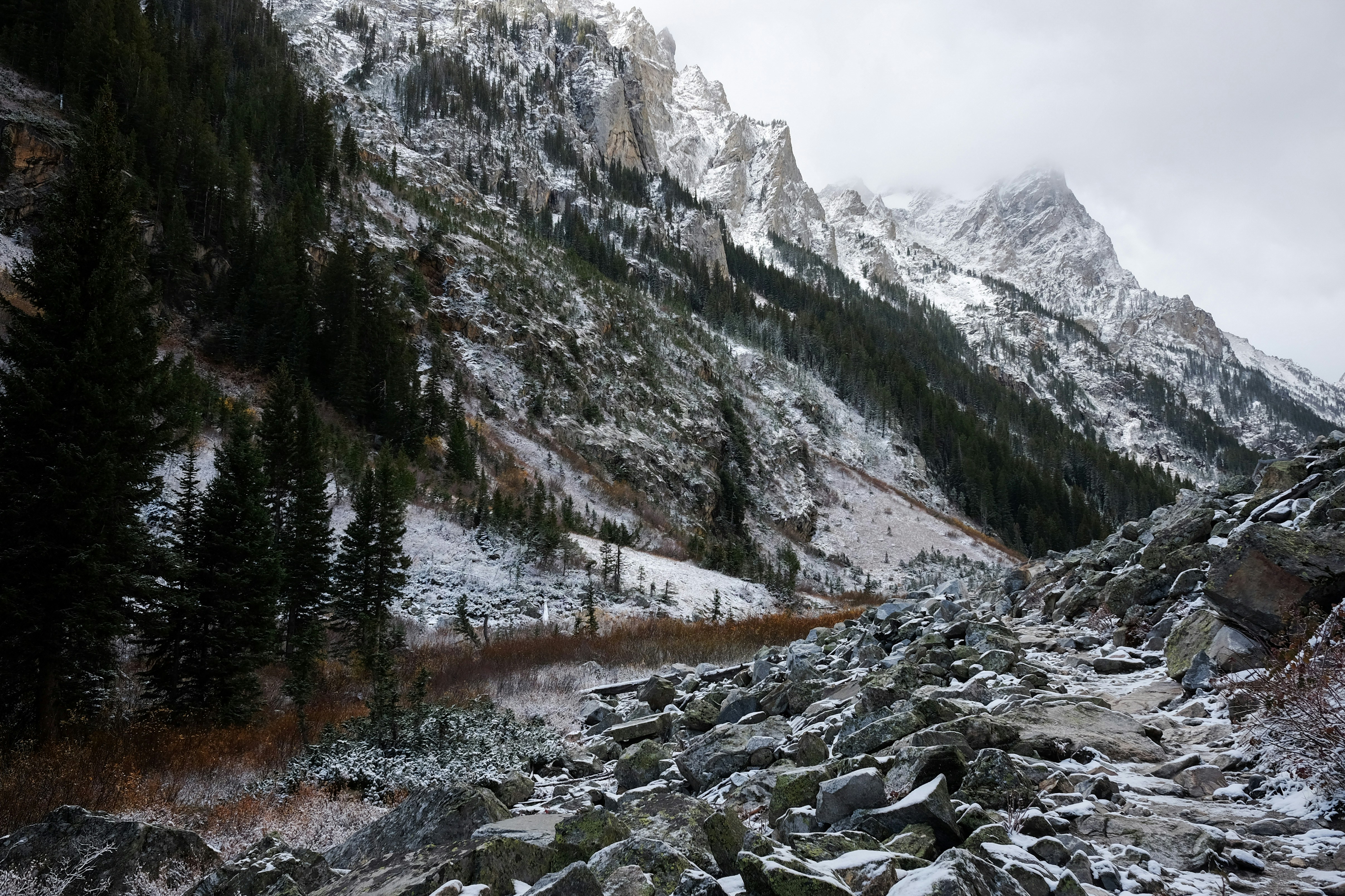 Gray rocky mountain near body of water during daytime photo – Free ...