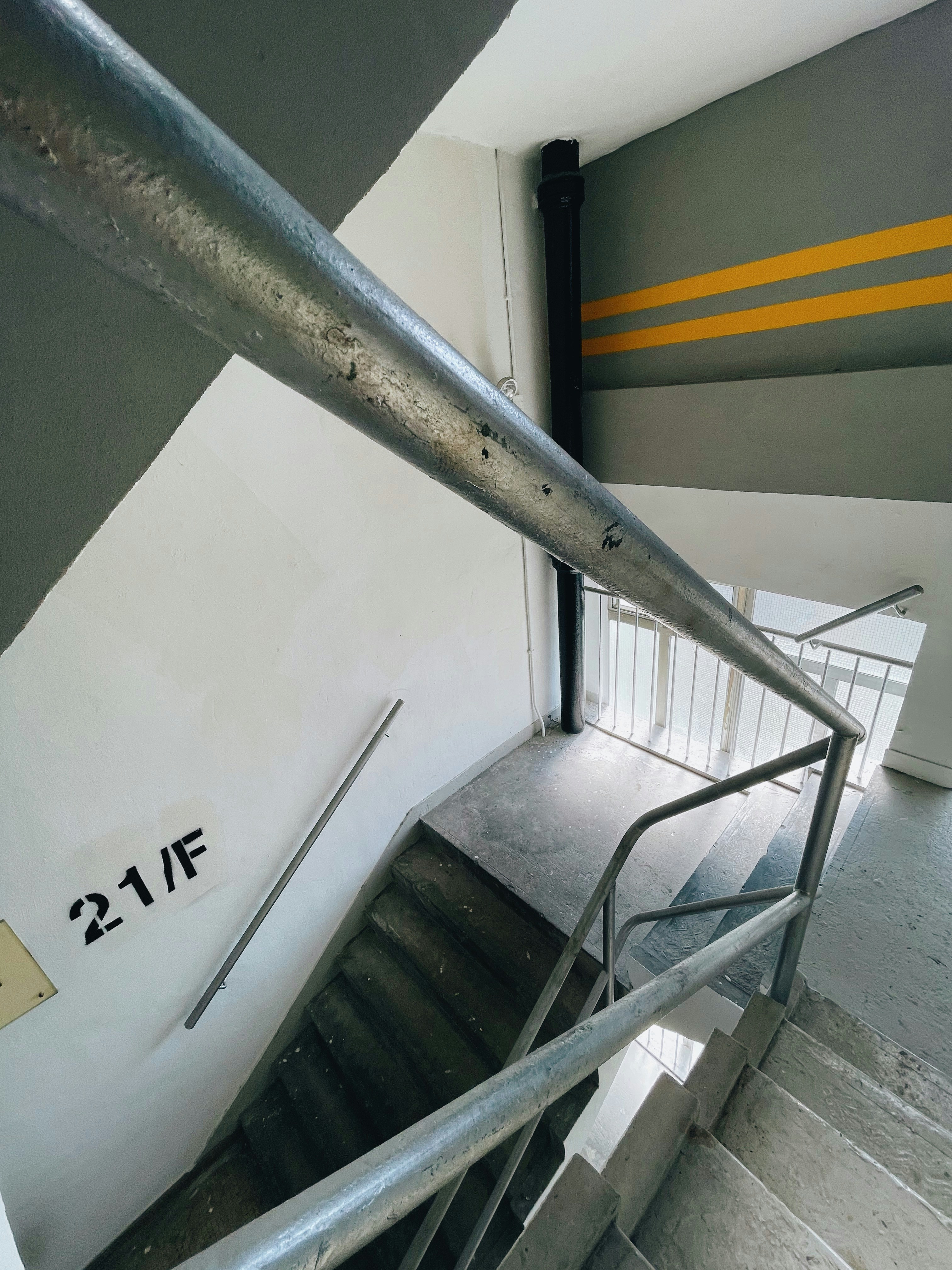 stainless steel ladder on white wall
