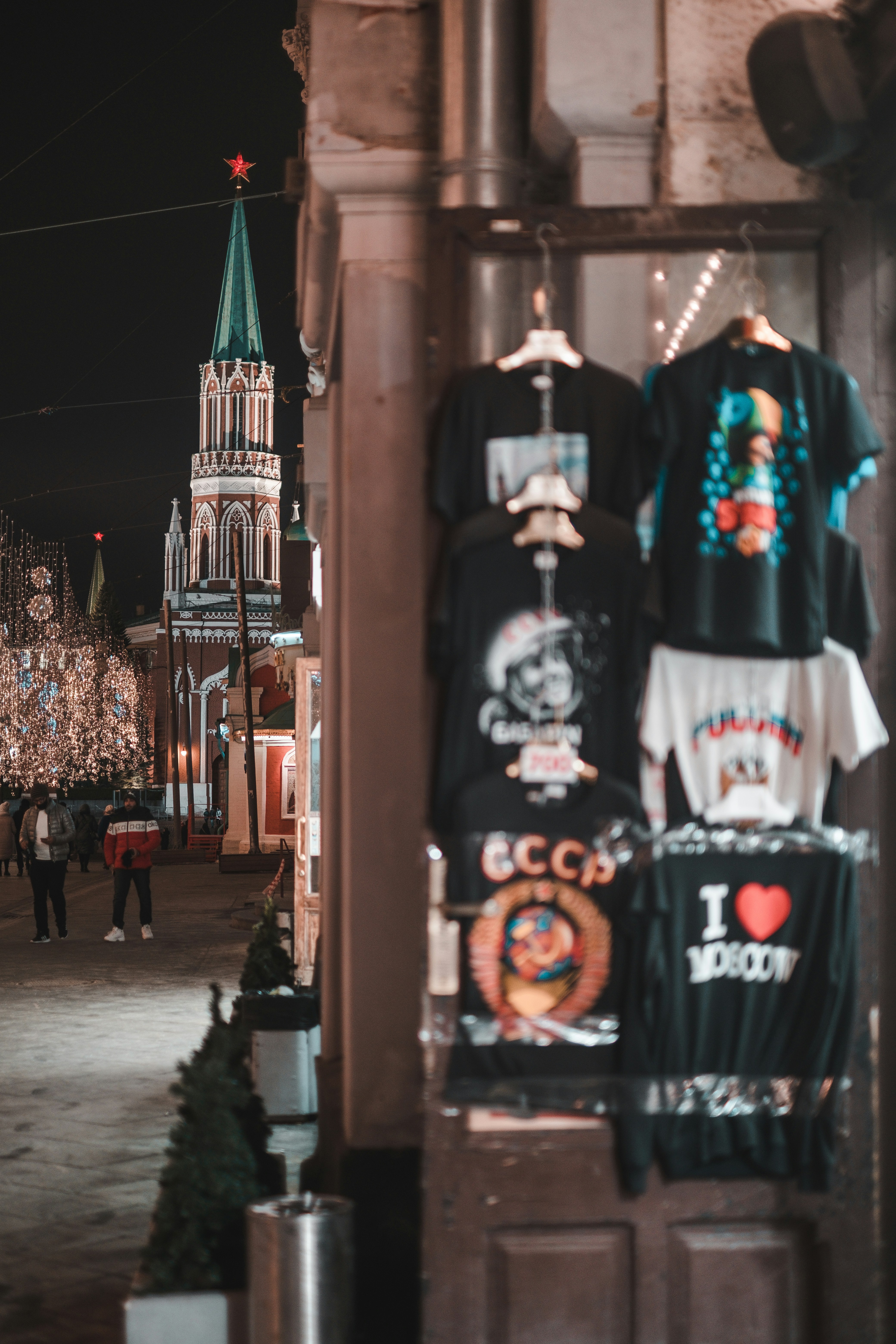 Red Star Spire at Night: A Market Street Framed by a Historic Tower