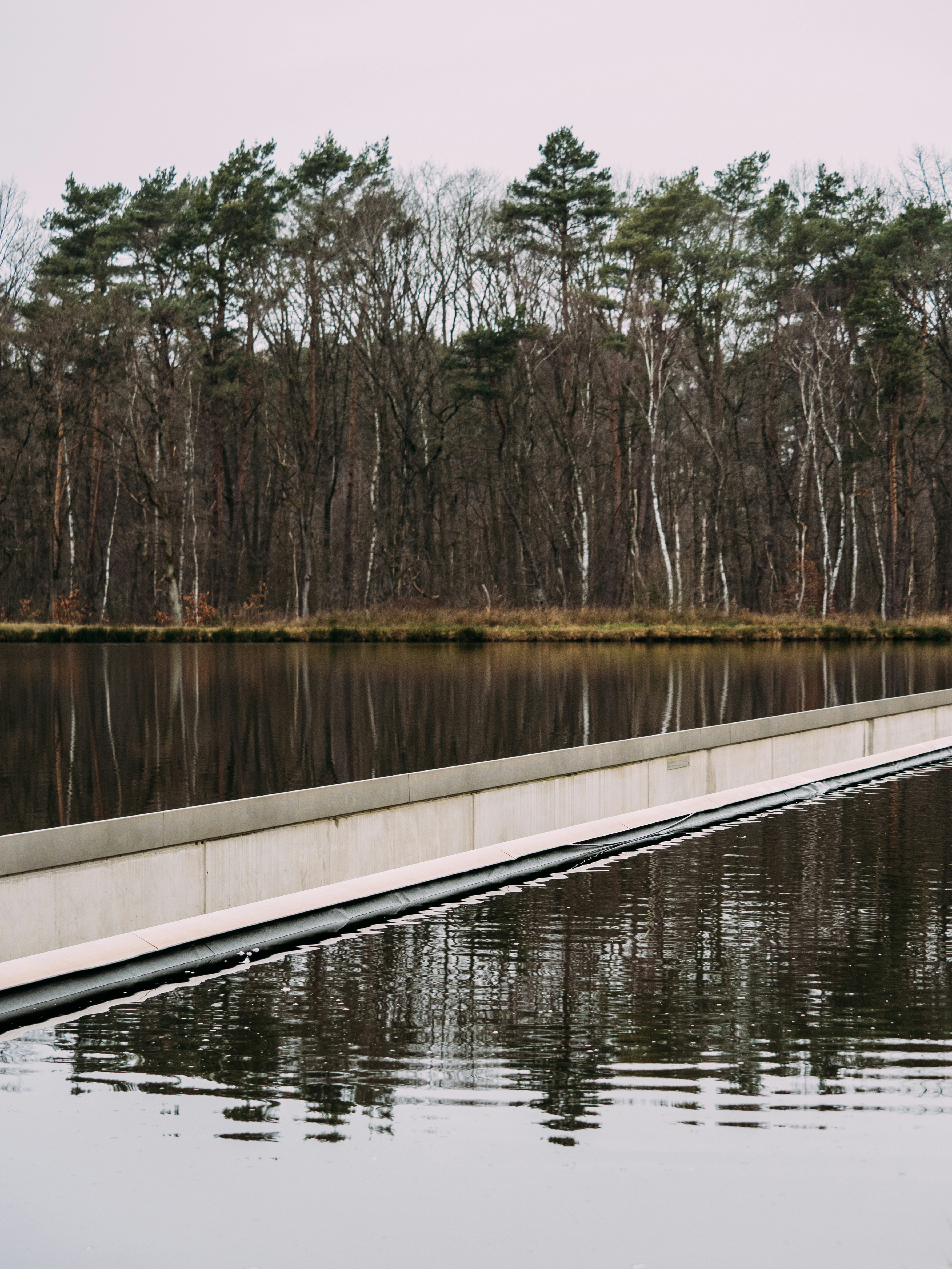 brown wooden bridge over river