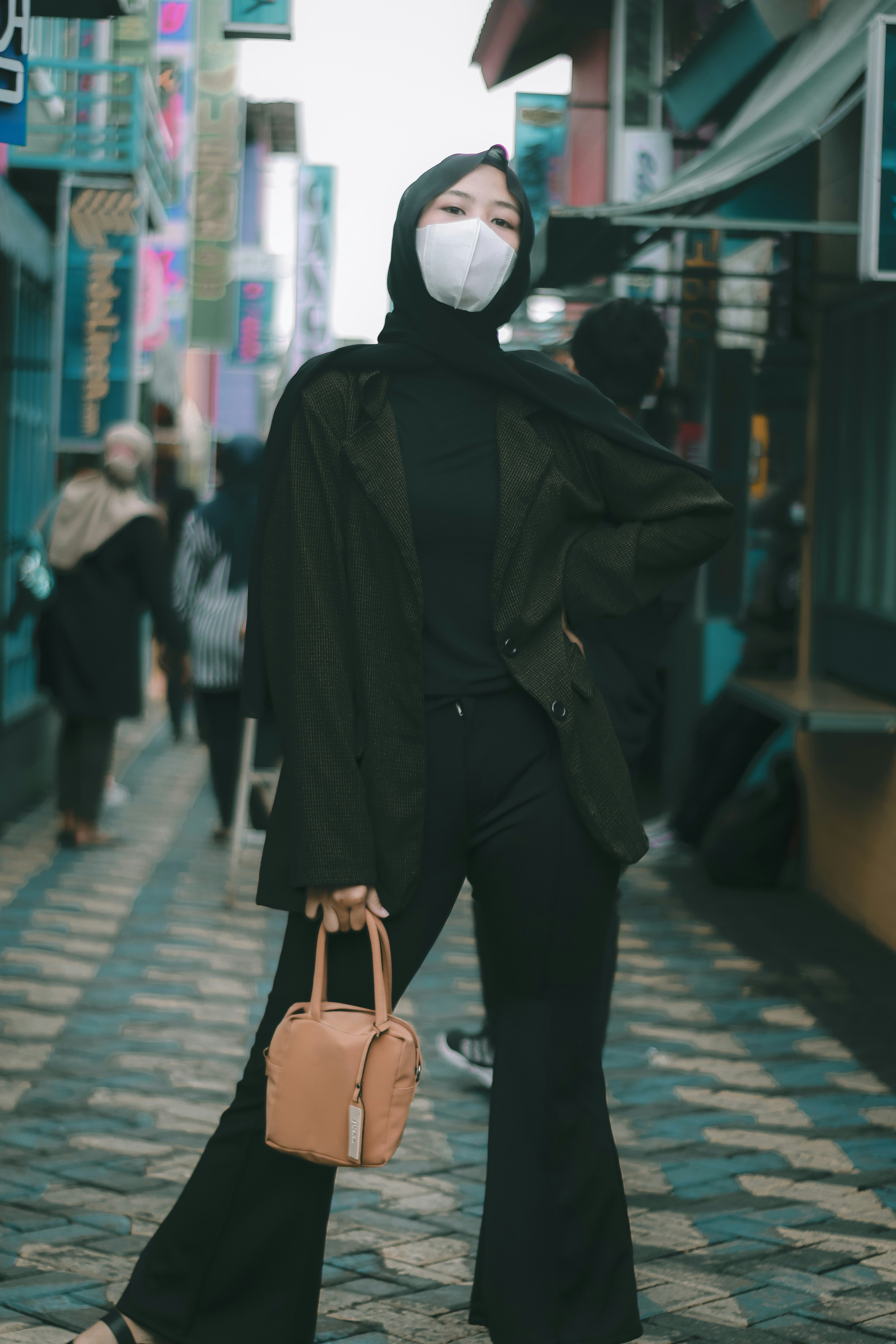 Masked Poise on a Neon-Edged Street