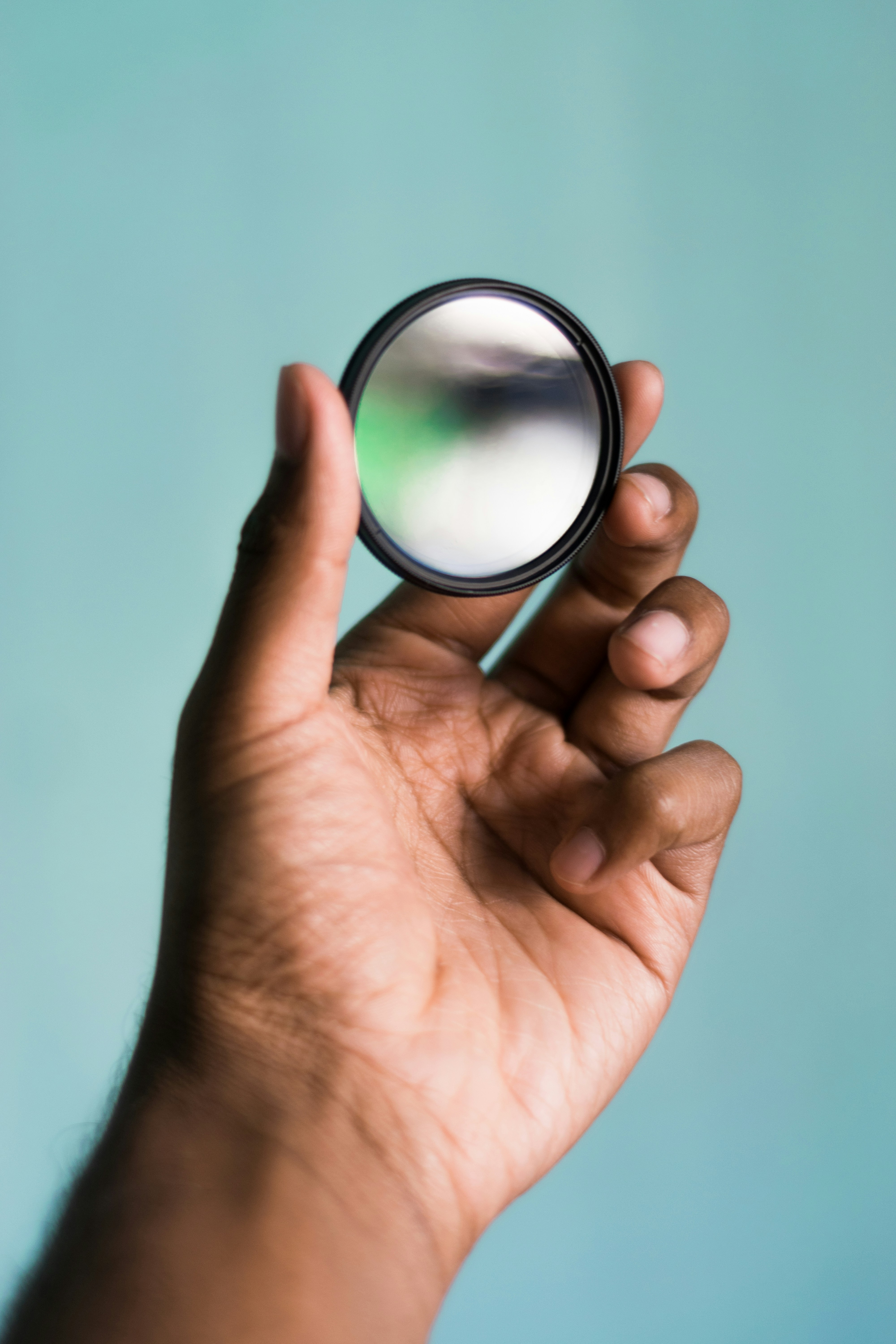 Person holding round magnifying glass photo – Free Grey Image on Unsplash