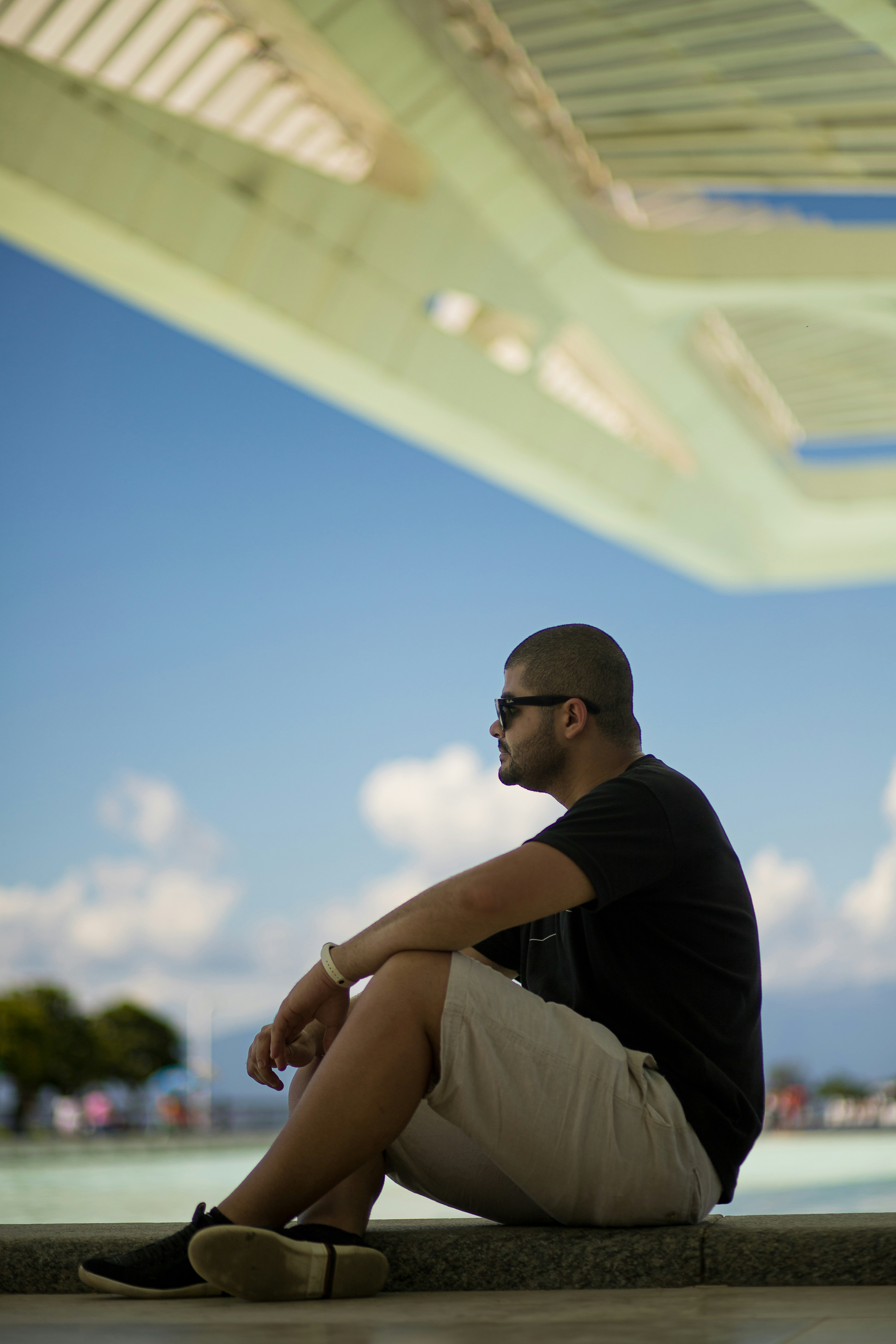 Quiet Contemplation Under a Mint Canopy by the Pool