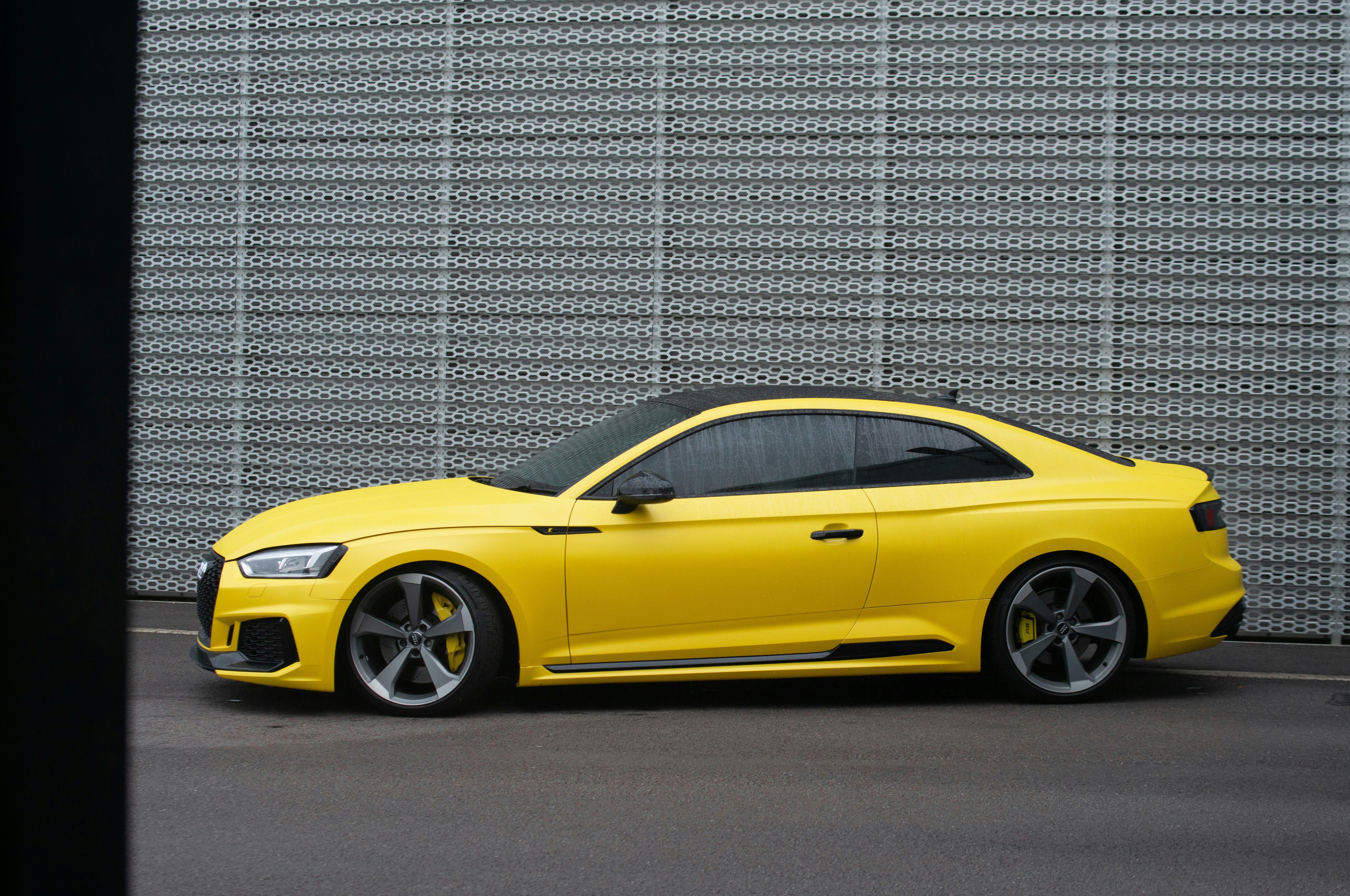 Yellow porsche 911 parked near gray wall photo – Free Audi rs5 Image on ...