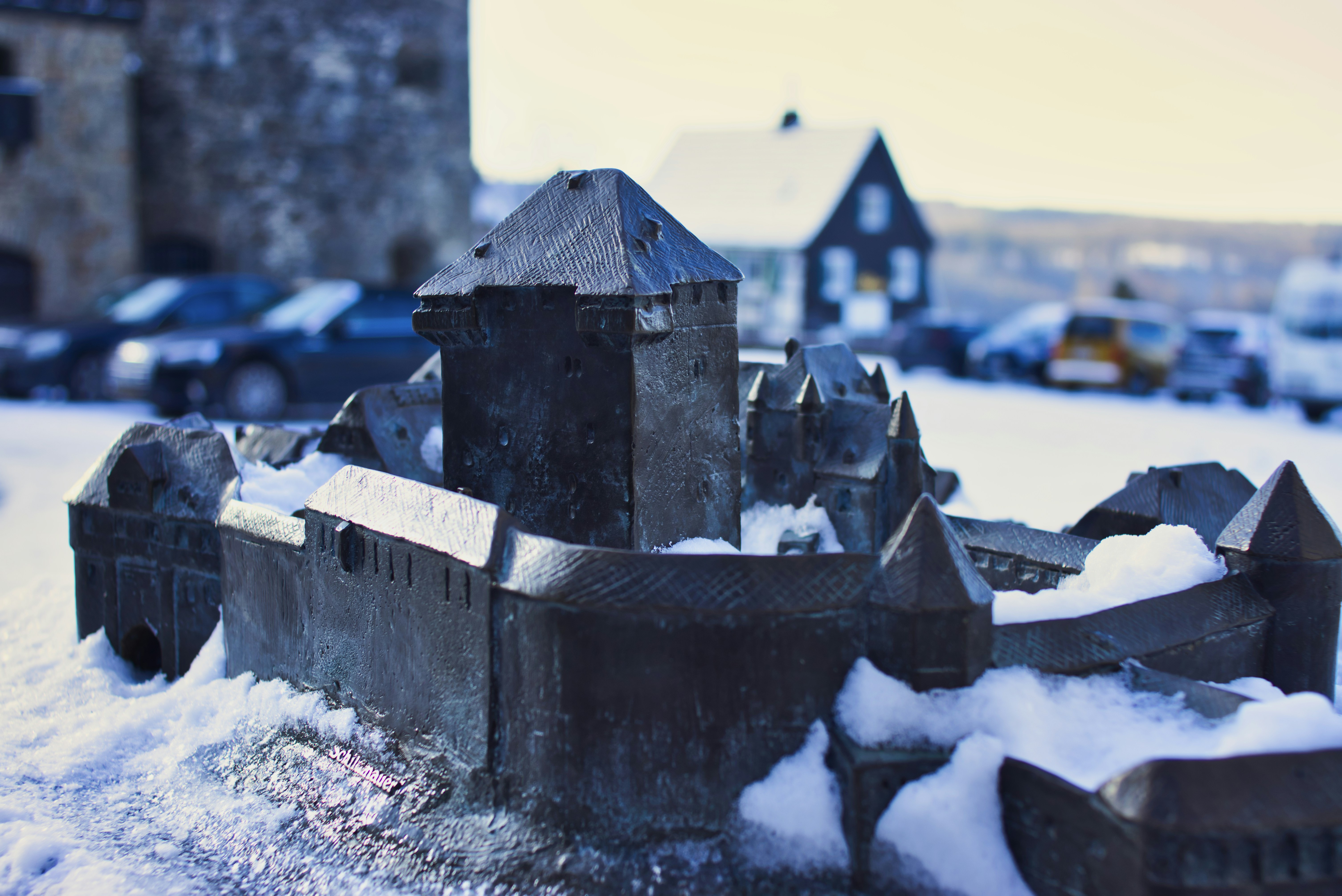 Snow-Crowned Fortress: Miniature Castles in Cold Focus