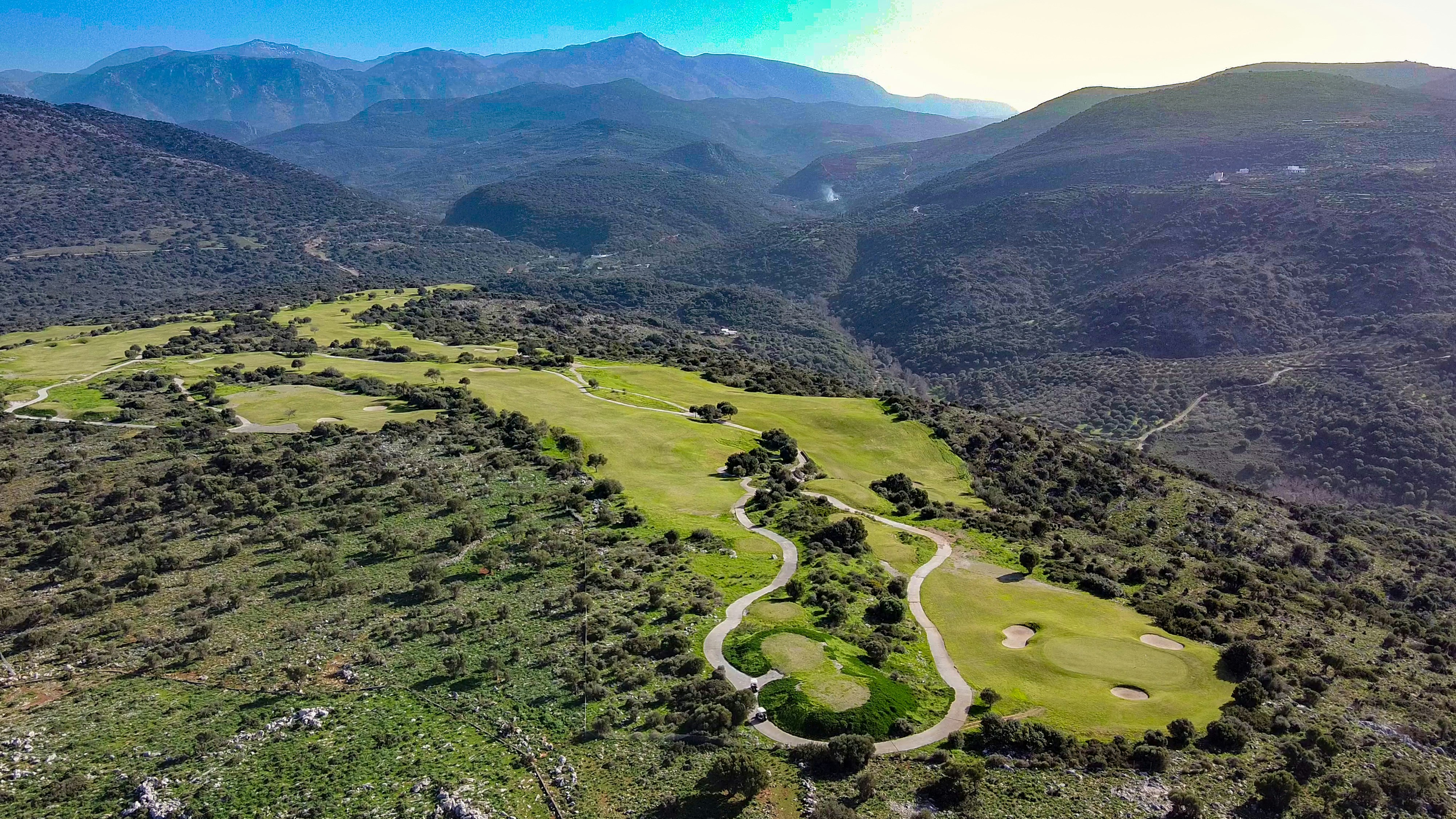 Green grass field and mountain during daytime photo – Free Crete golf ...