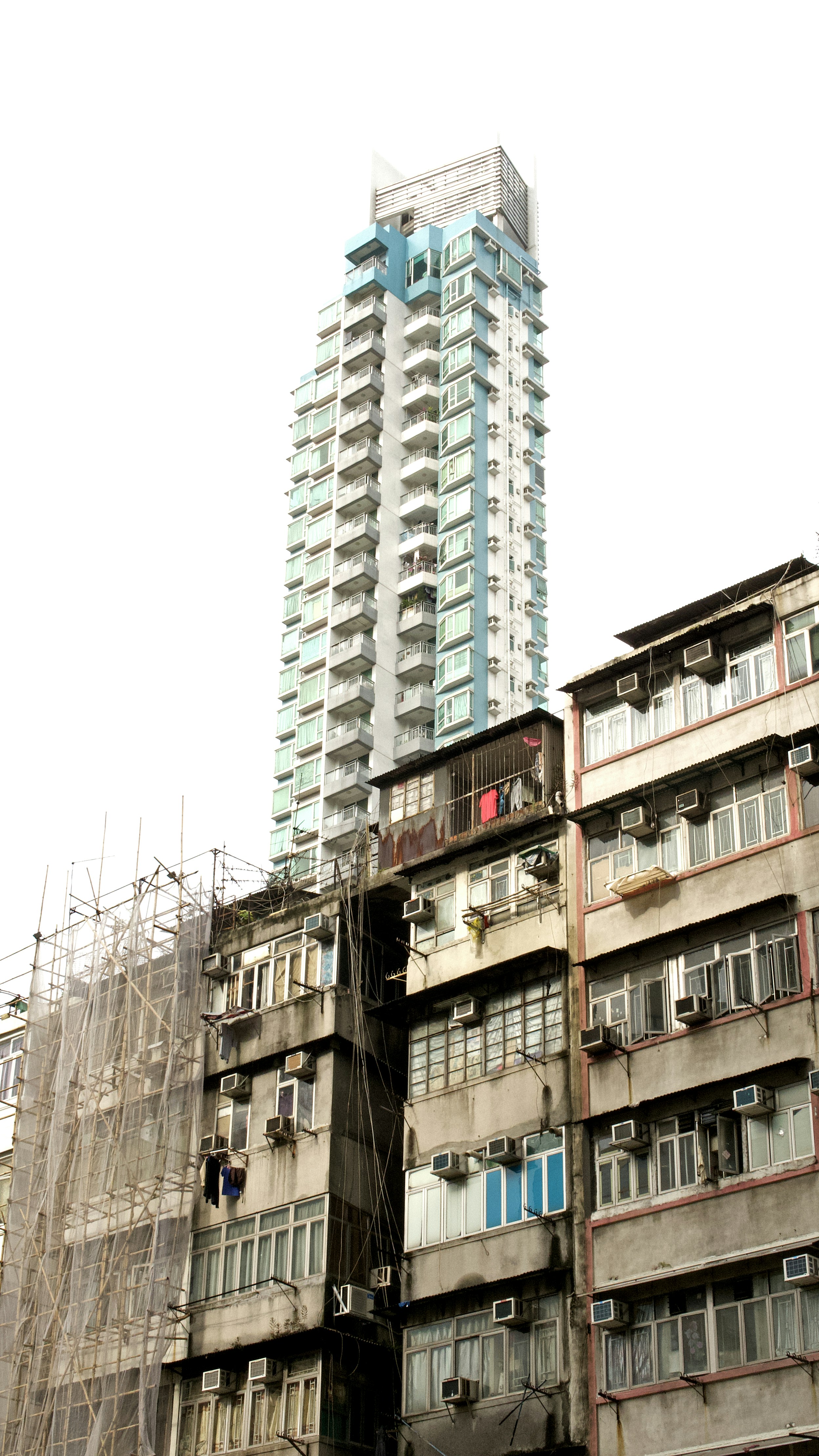 Cobalt Spire Rises Over a Patchwork of Dwellings