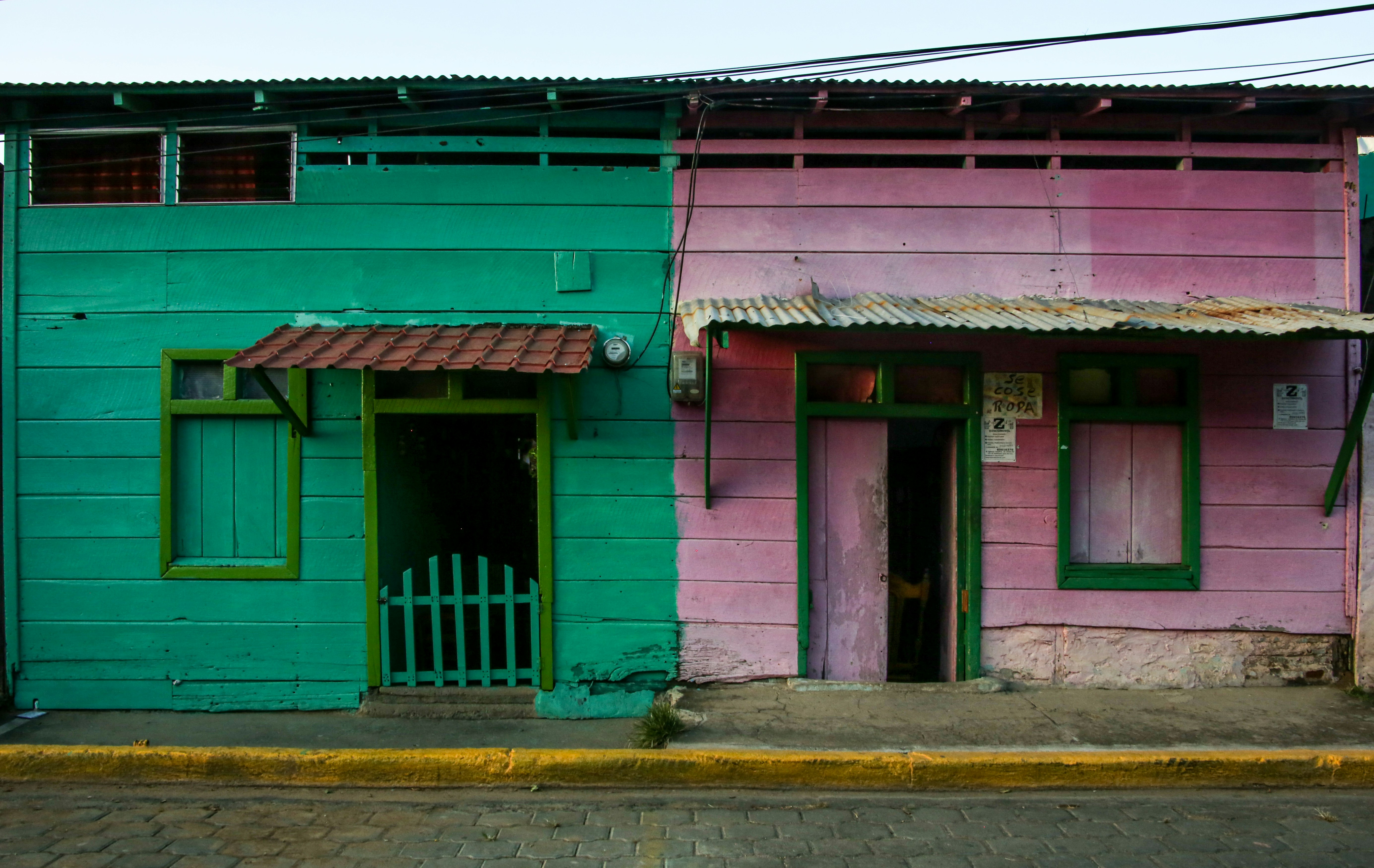 Pastel Doors: A Split-Color Street Façade