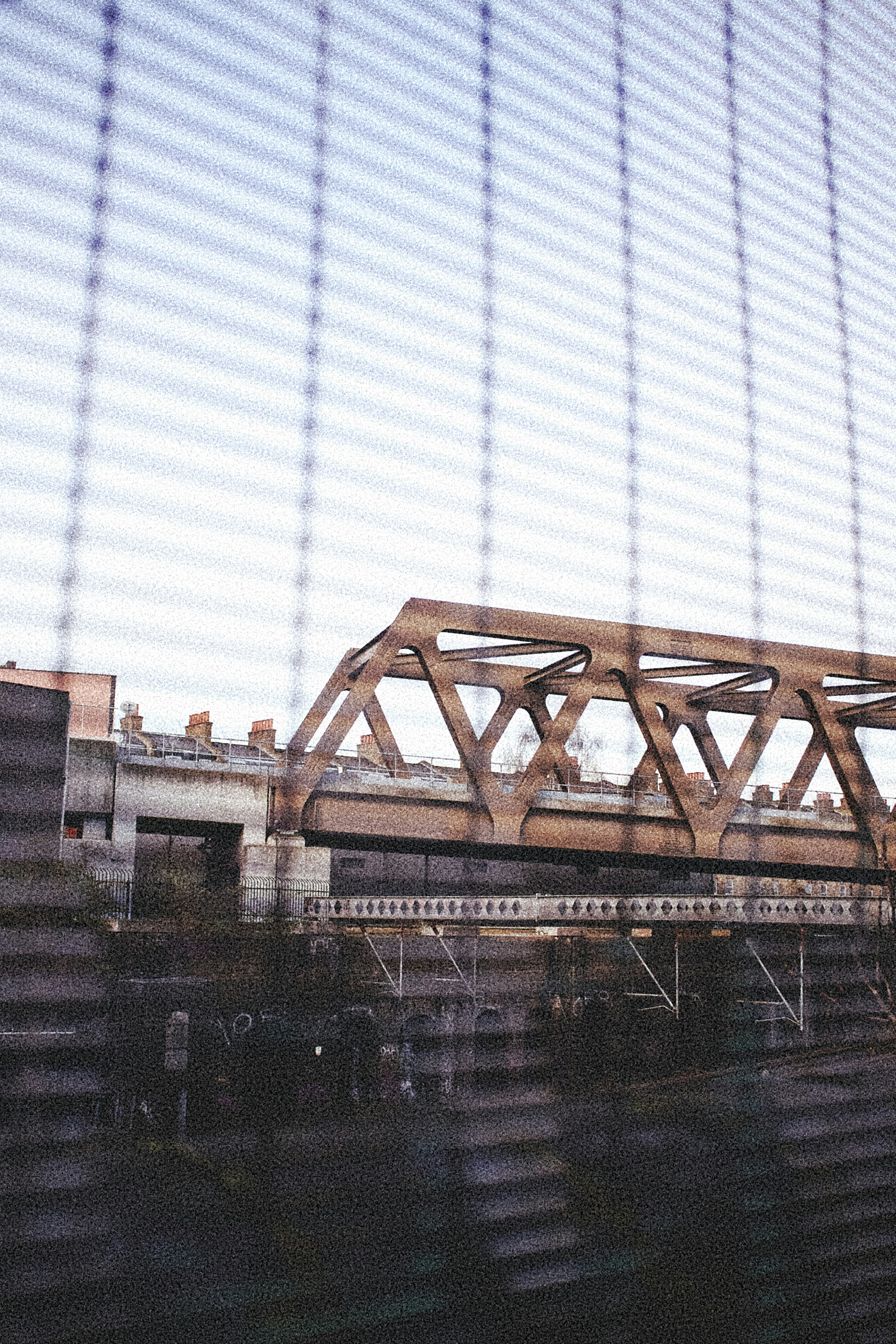 brown bridge over water during daytime