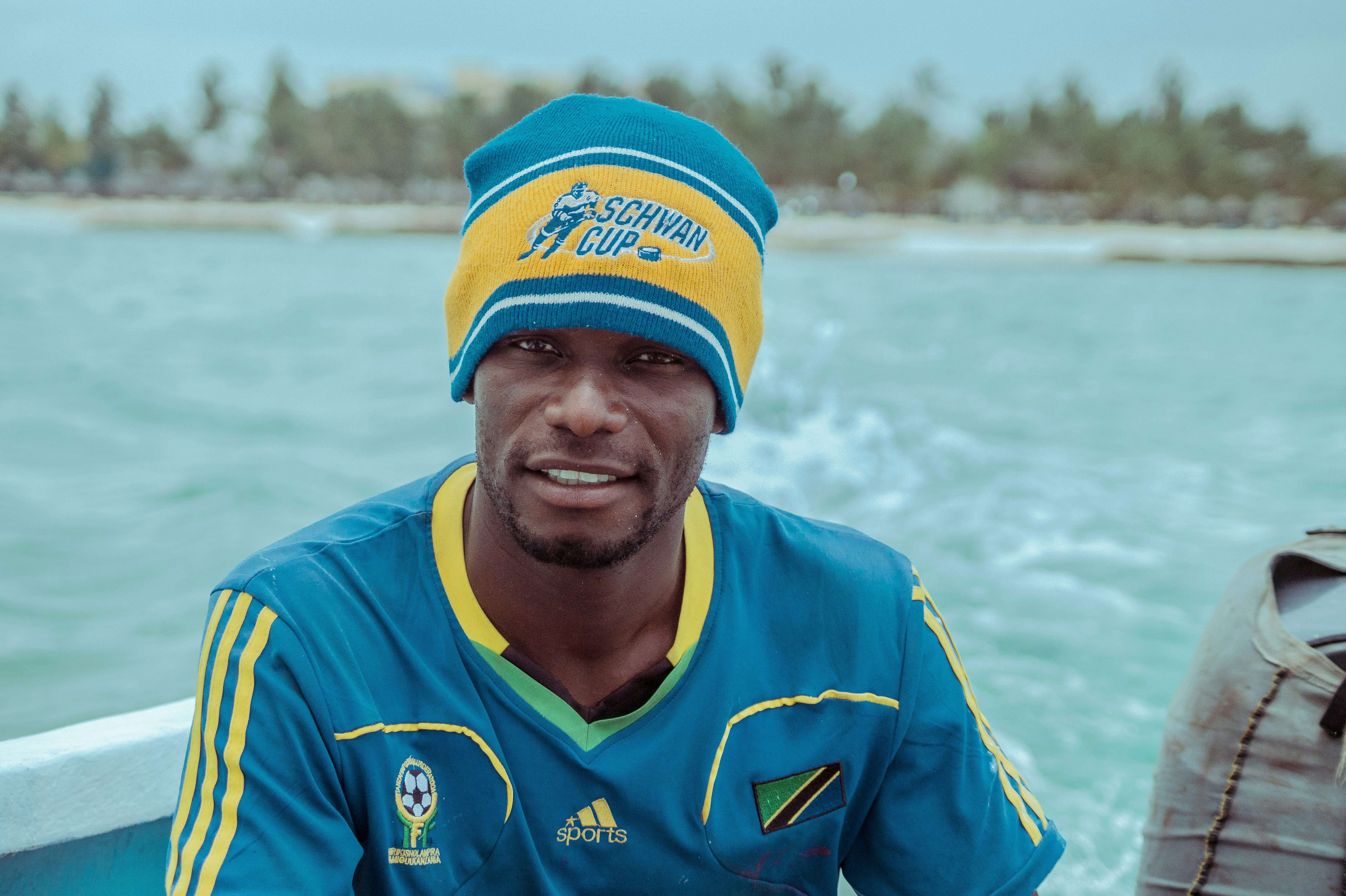 // boatman | man in yellow and blue adidas fly emirates jersey shirt