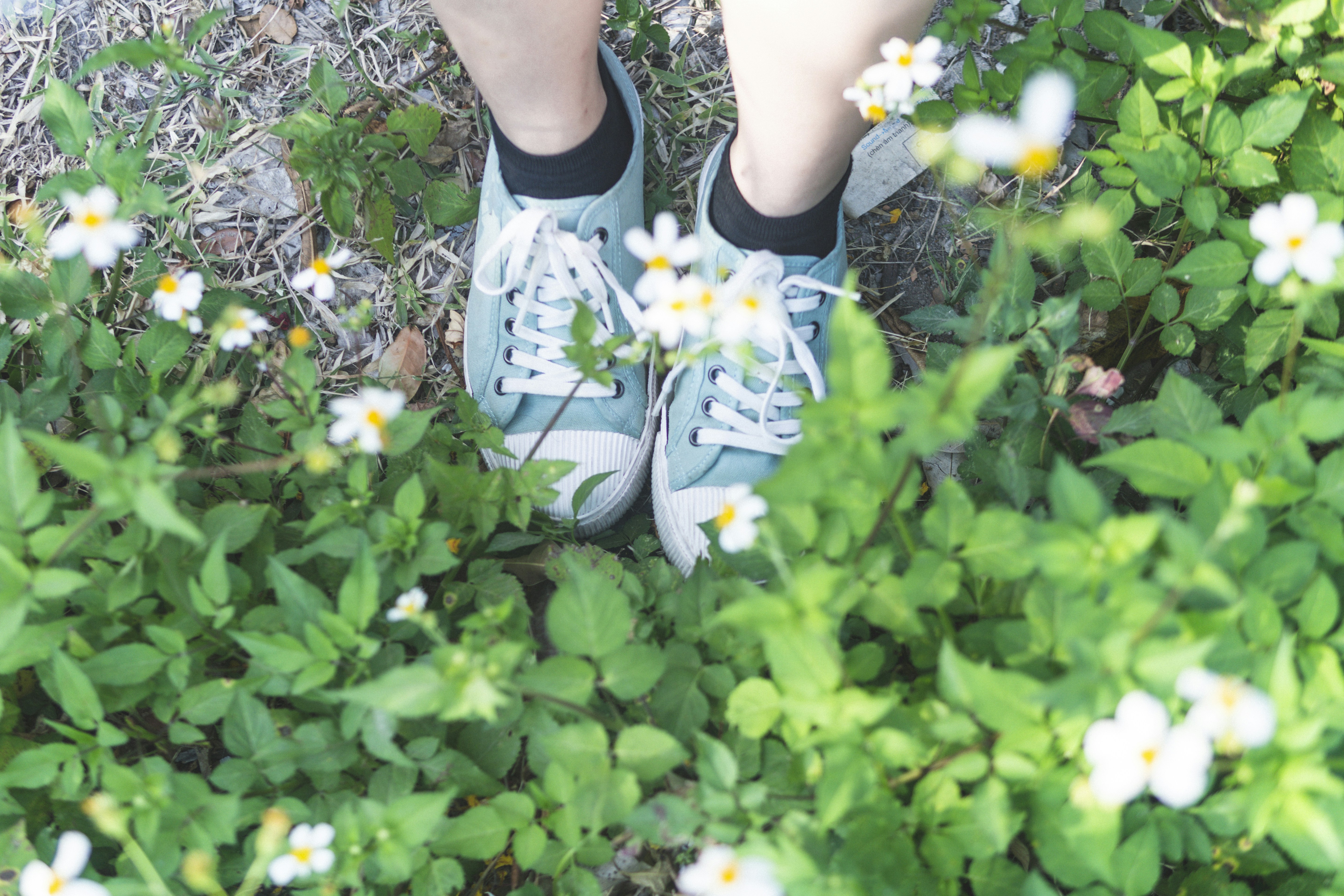 person wearing gray and yellow running shoes