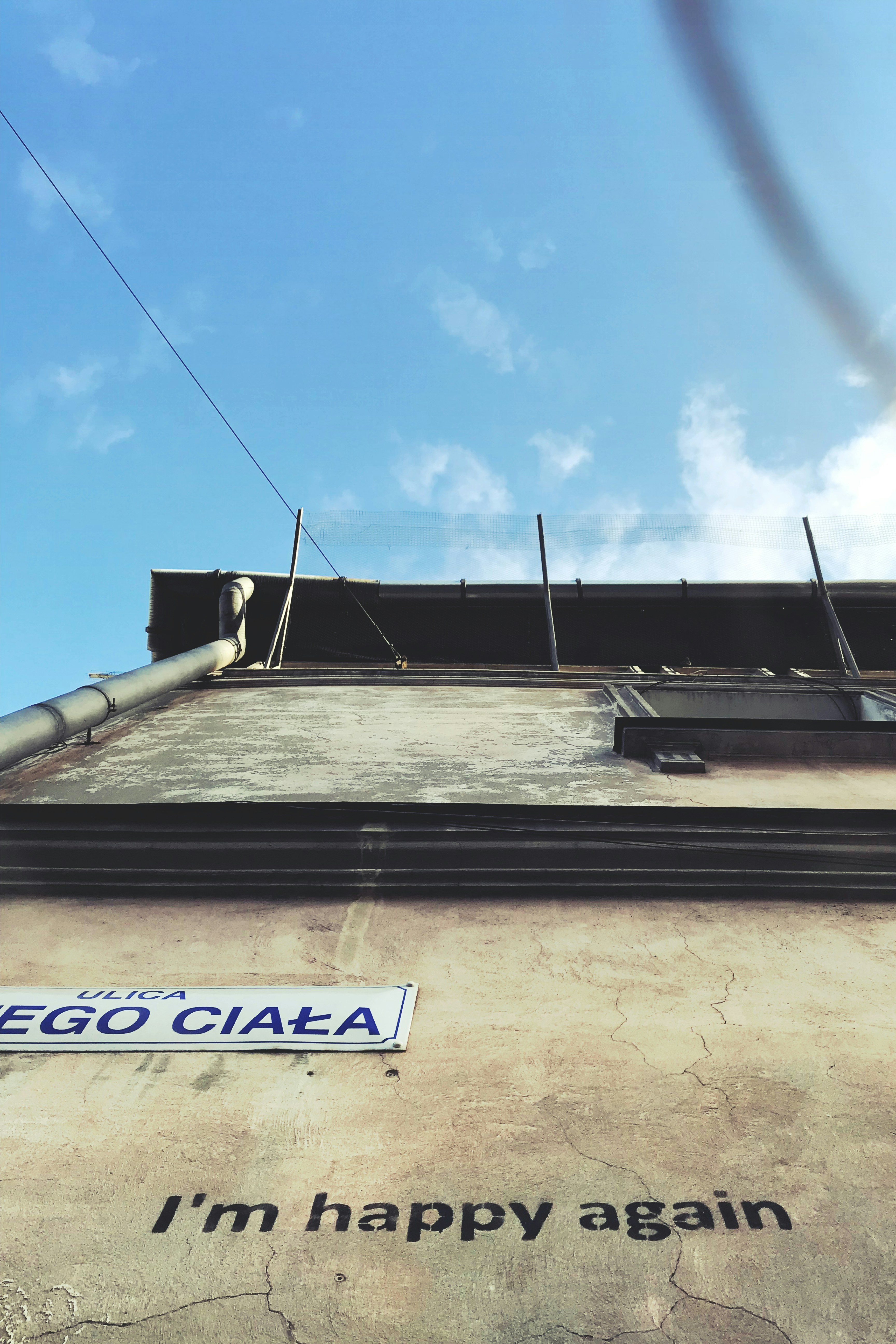 A sign on the side of a building that says i'm happy again photo – Free ...