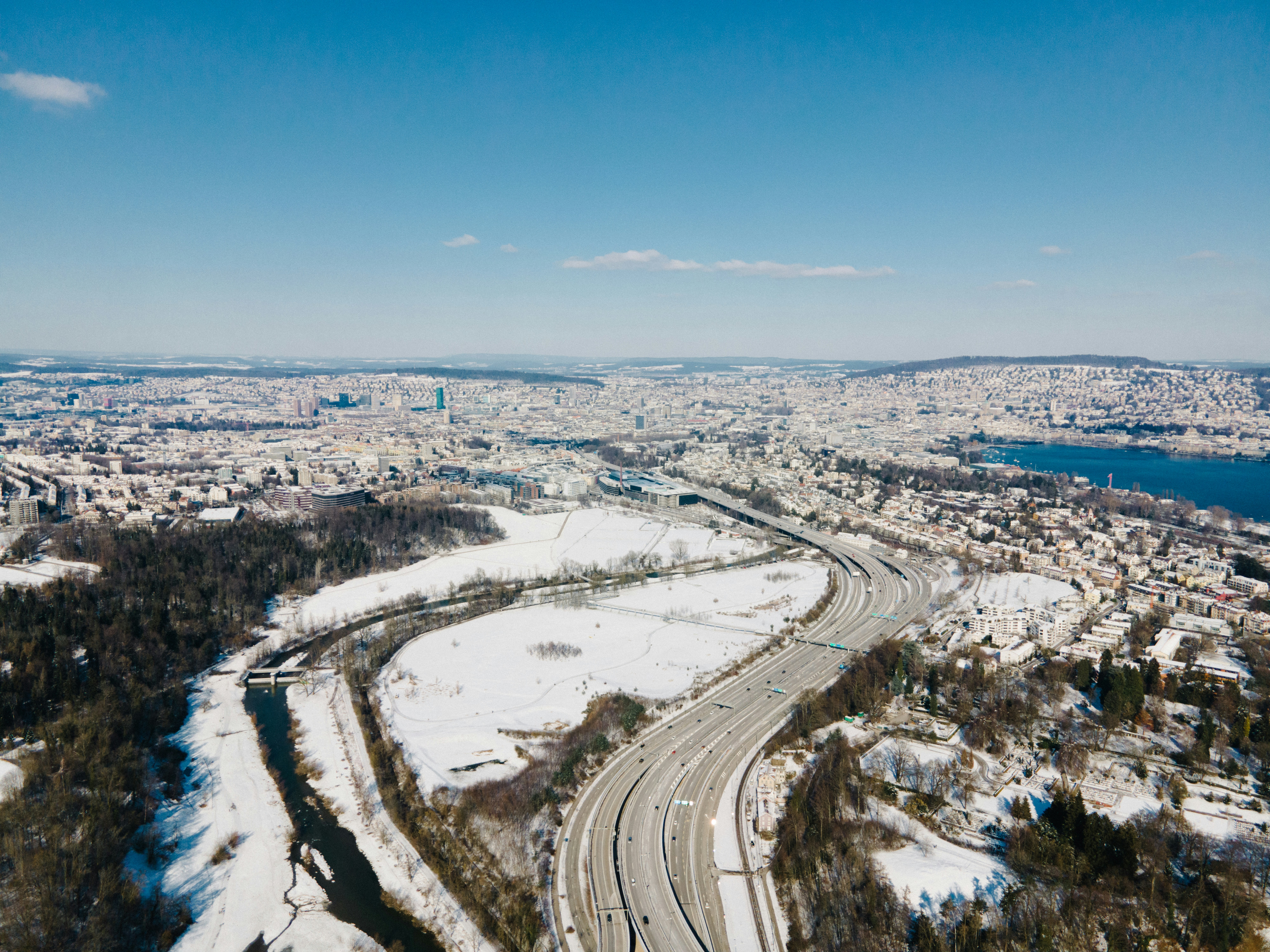 Snowbound Highway Overlook: A Winter Cityscape from Above