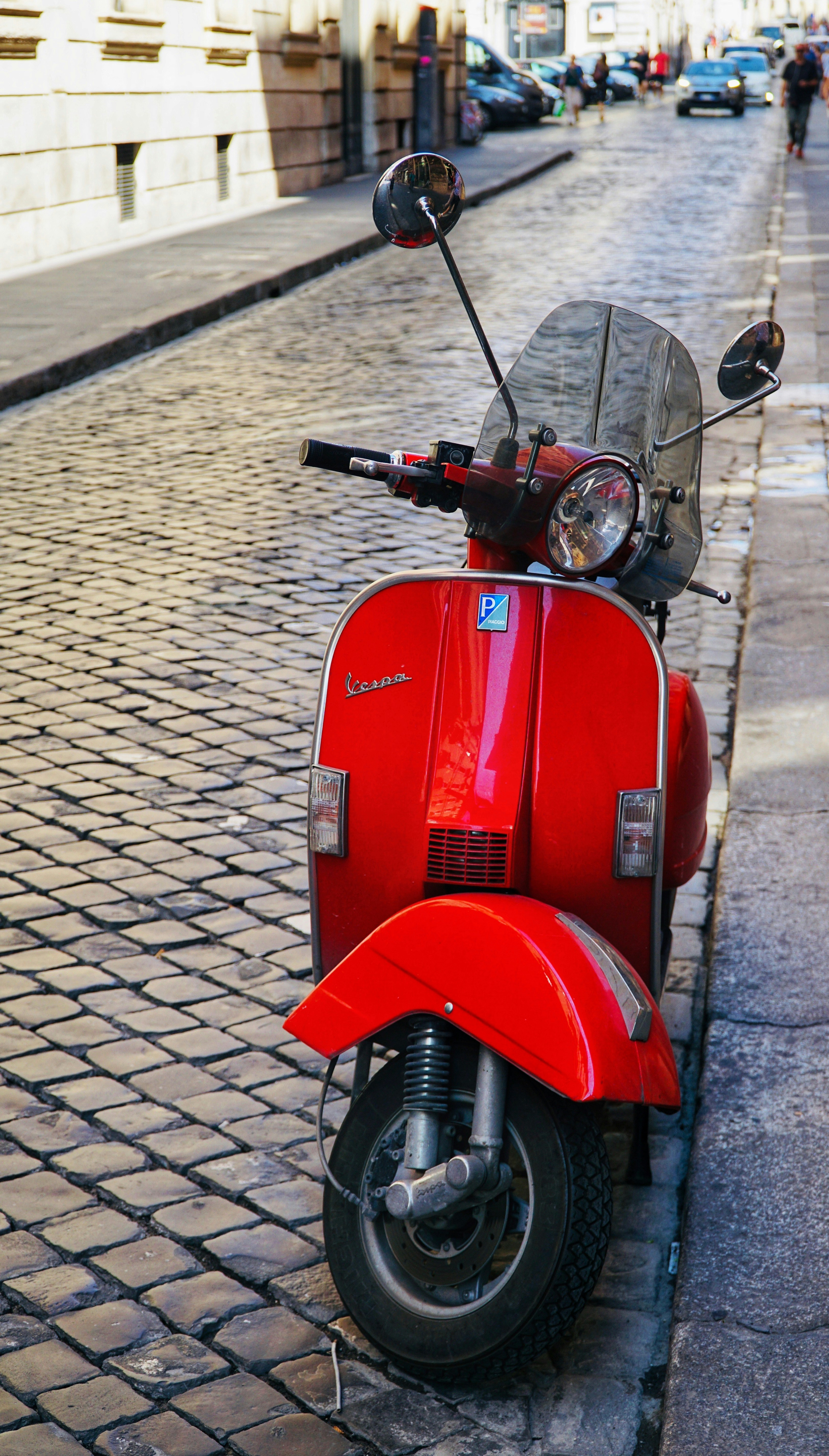 Red motor scooter parked on gray brick pavement photo – Free Rome Image ...