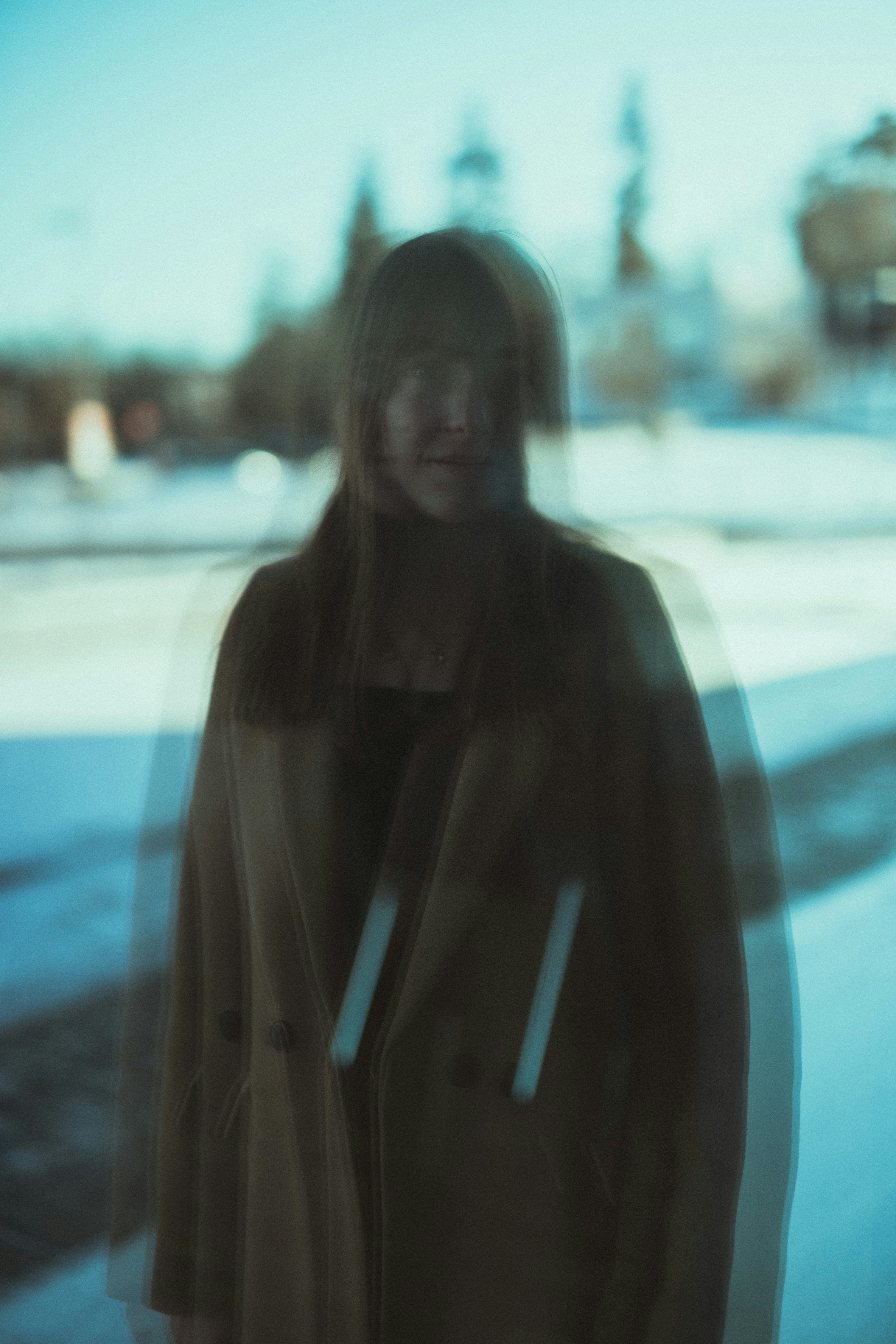 Cyan Veil: A Double-Exposure Portrait Woven with Winter Light