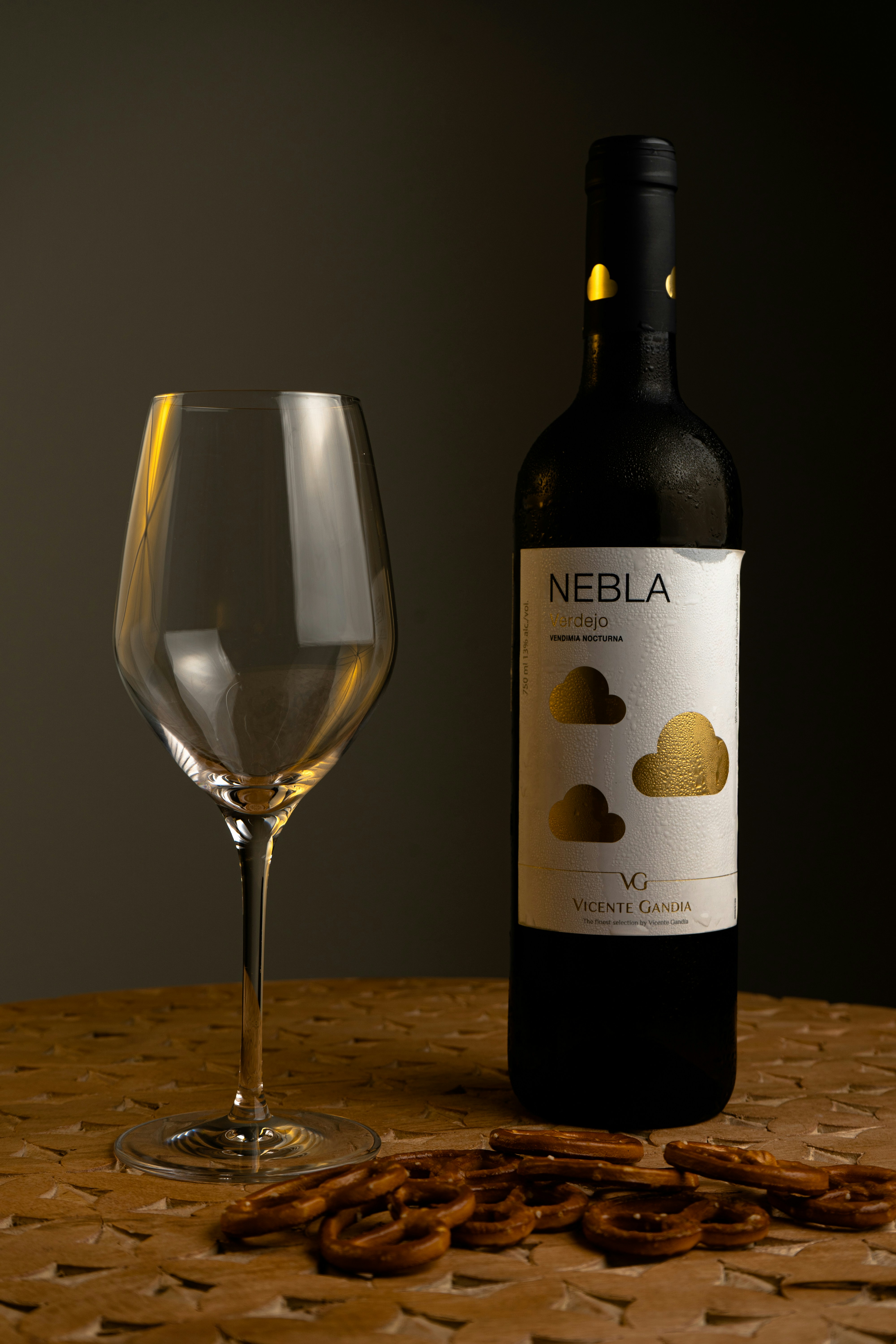 Nebla in Warm Focus: A Quiet Still-Life of Wine, Glass, and Pretzels