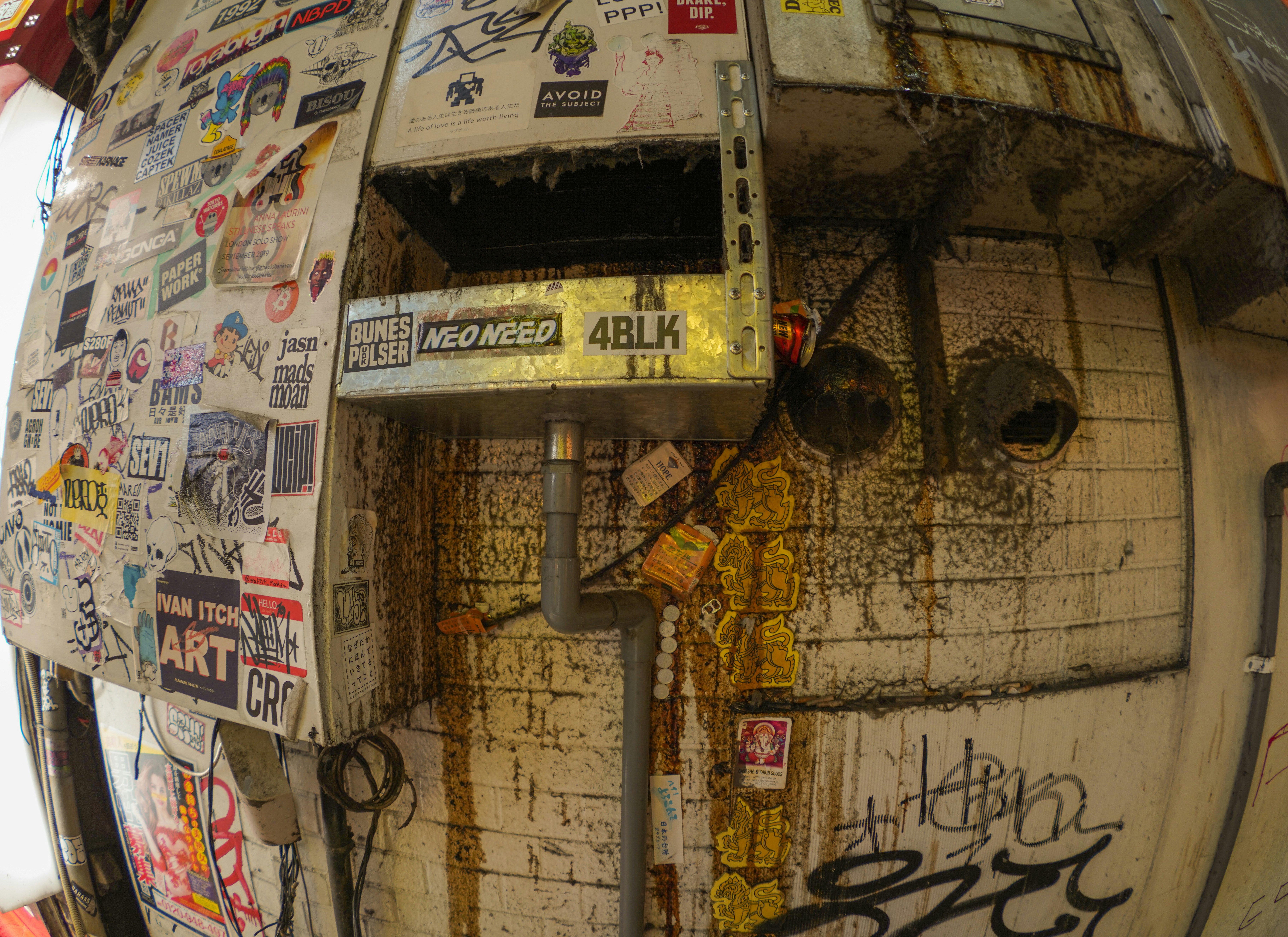 Streetside Poster Mosaic Above Weathered Plumbing