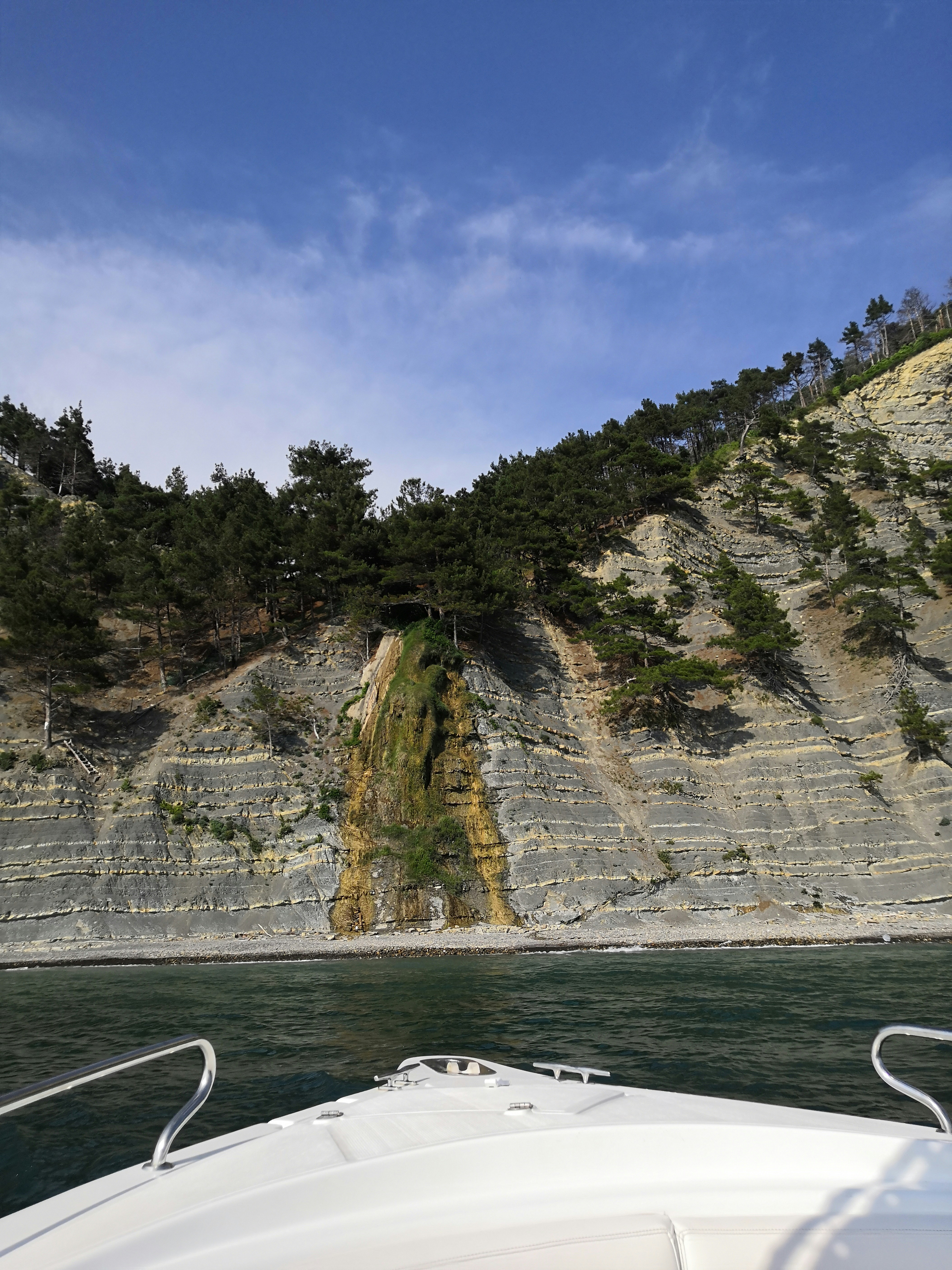 Bow View Toward Rocky Cliff Edge from a Boat