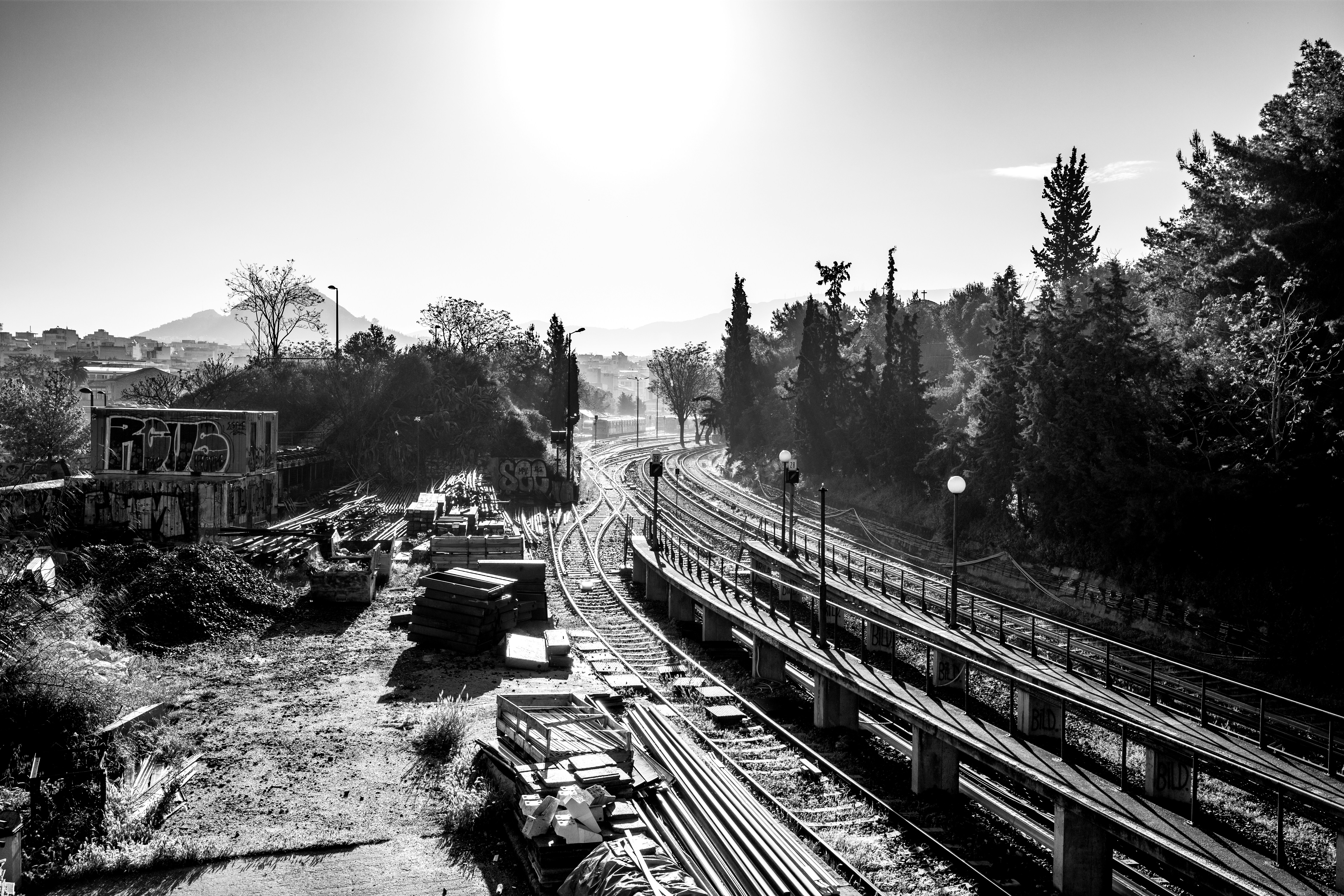 Grayscale photo of train rail photo – Free Athens Image on Unsplash