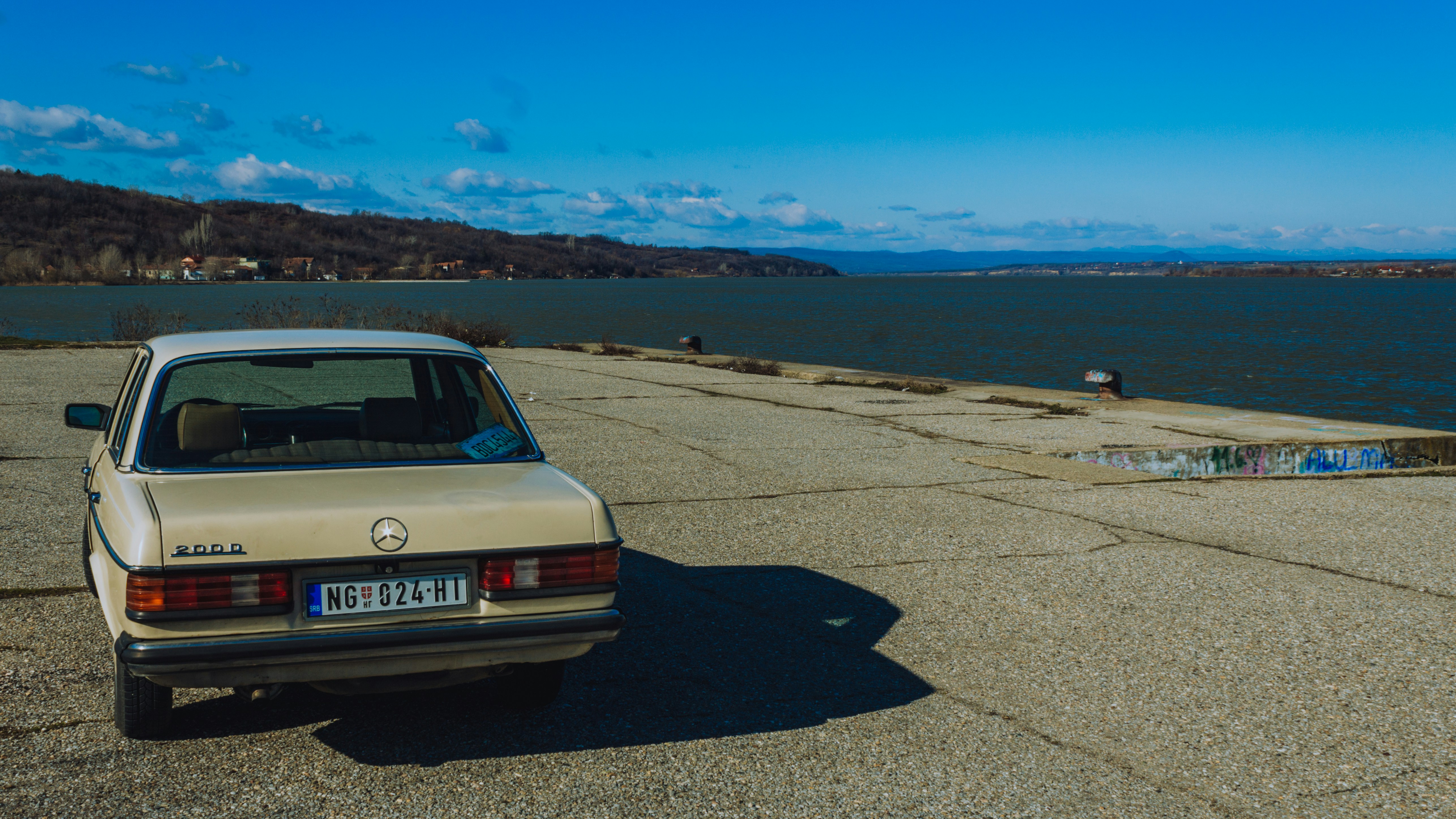 Silver bmw car on gray sand during daytime photo – Free Car Image on ...