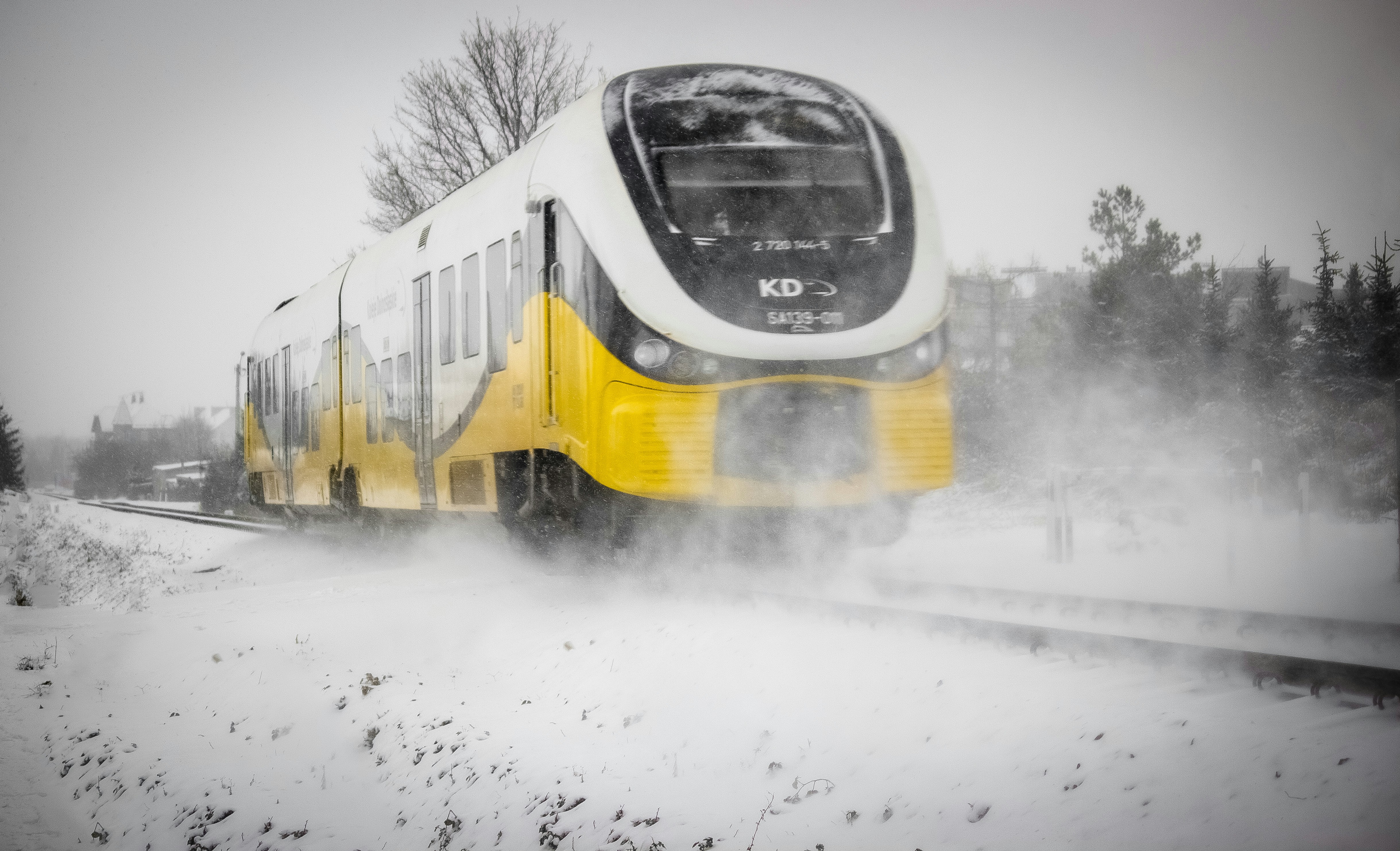 Yellow Express Carving Through a Snowbound Dawn