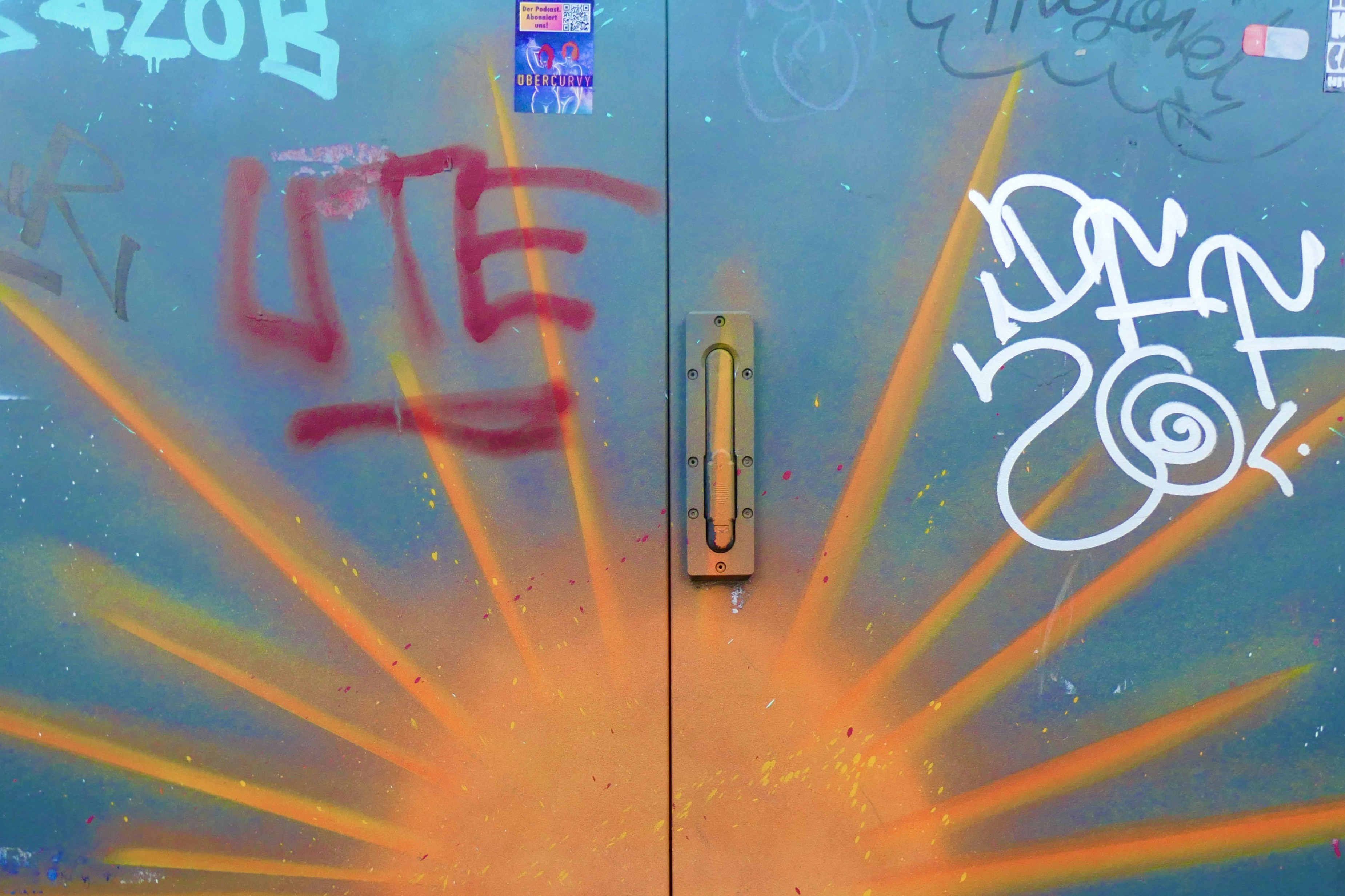 Sunburst Graffiti Door: Urban Color Convergence