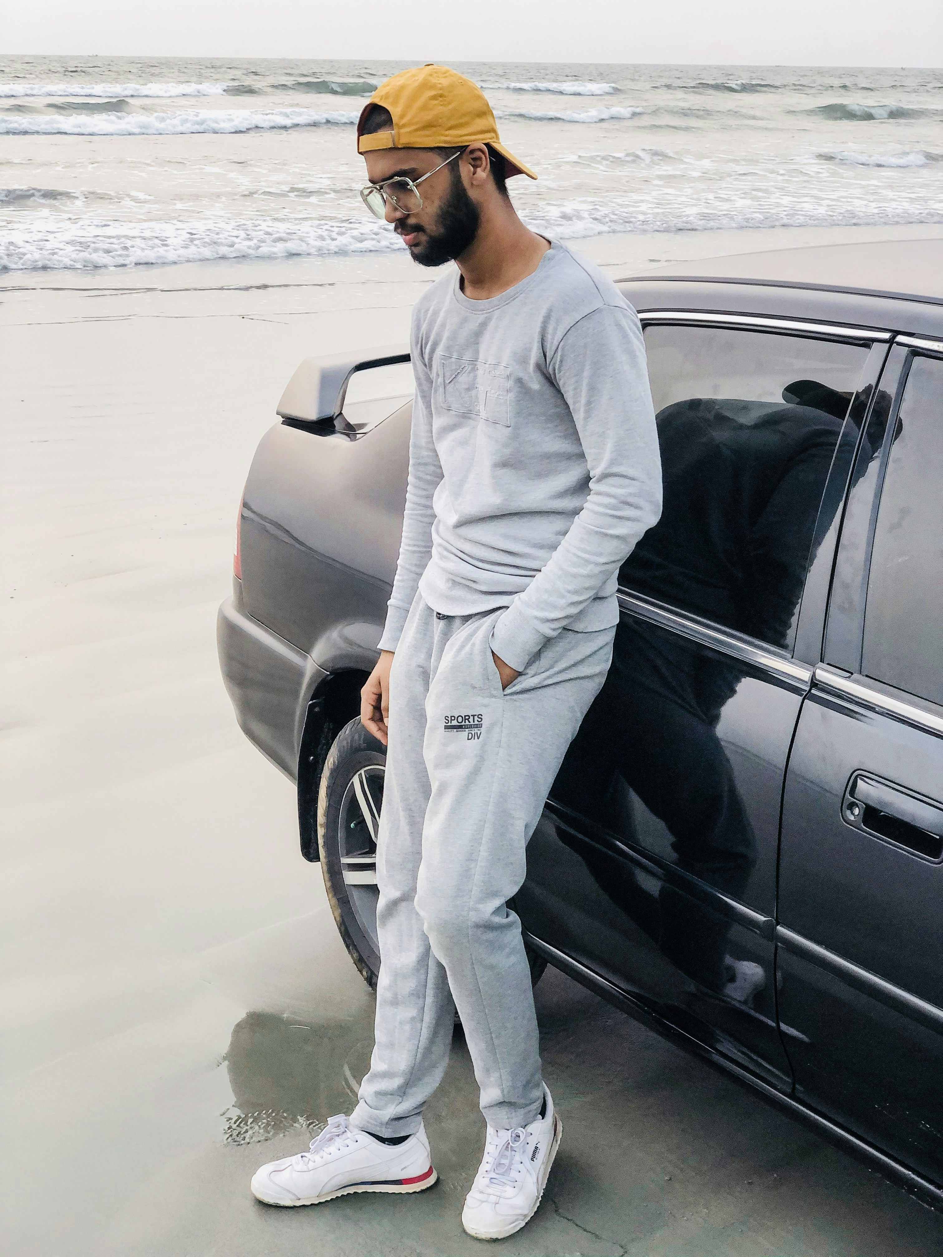 Coastal Chrome: A Casual Moment by the Car at Sunset Beach
