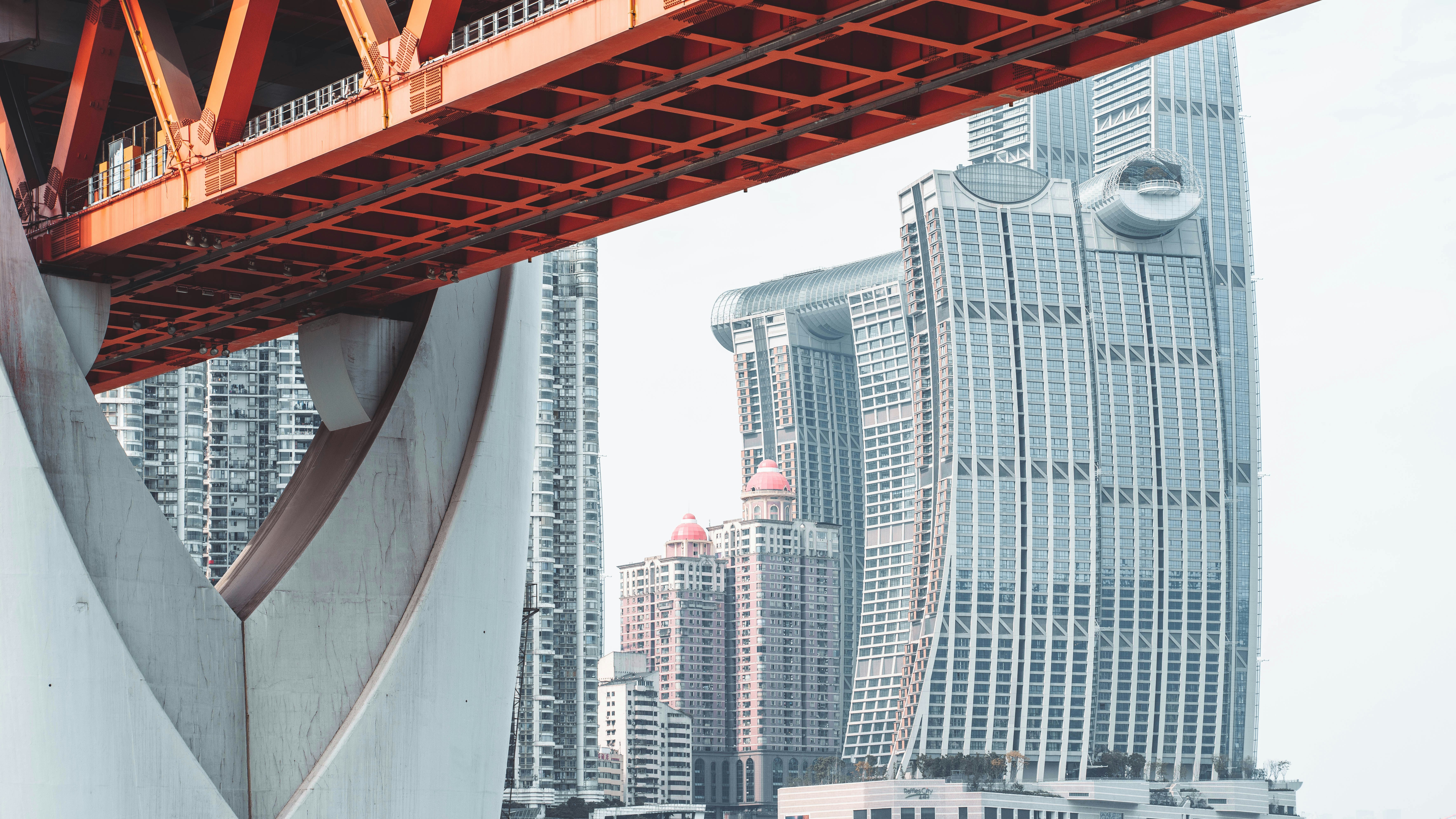 Red bridge over city buildings during daytime photo – Free Chongqing ...