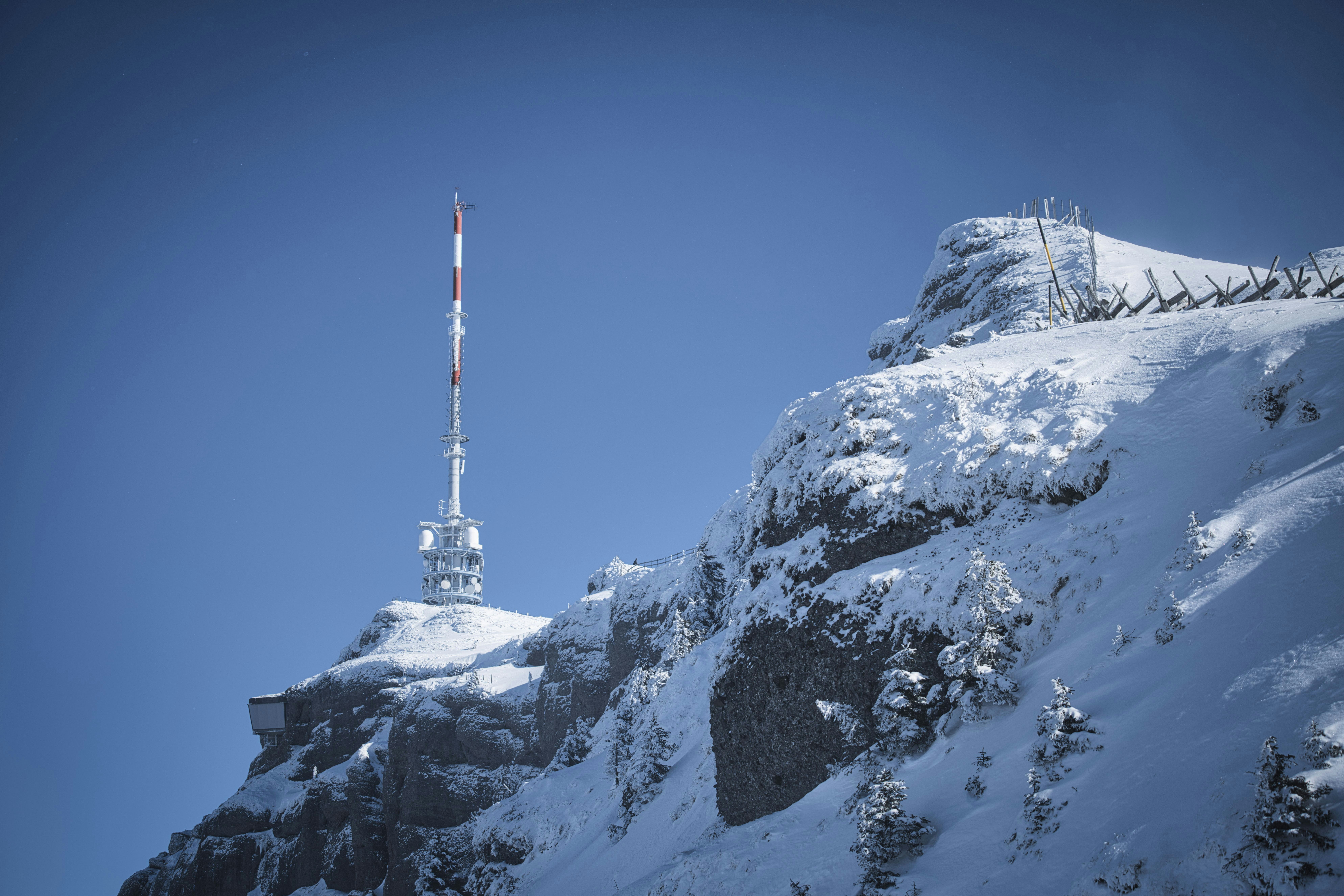 Snowbound Summit Mast: A Quiet Winter Beacon