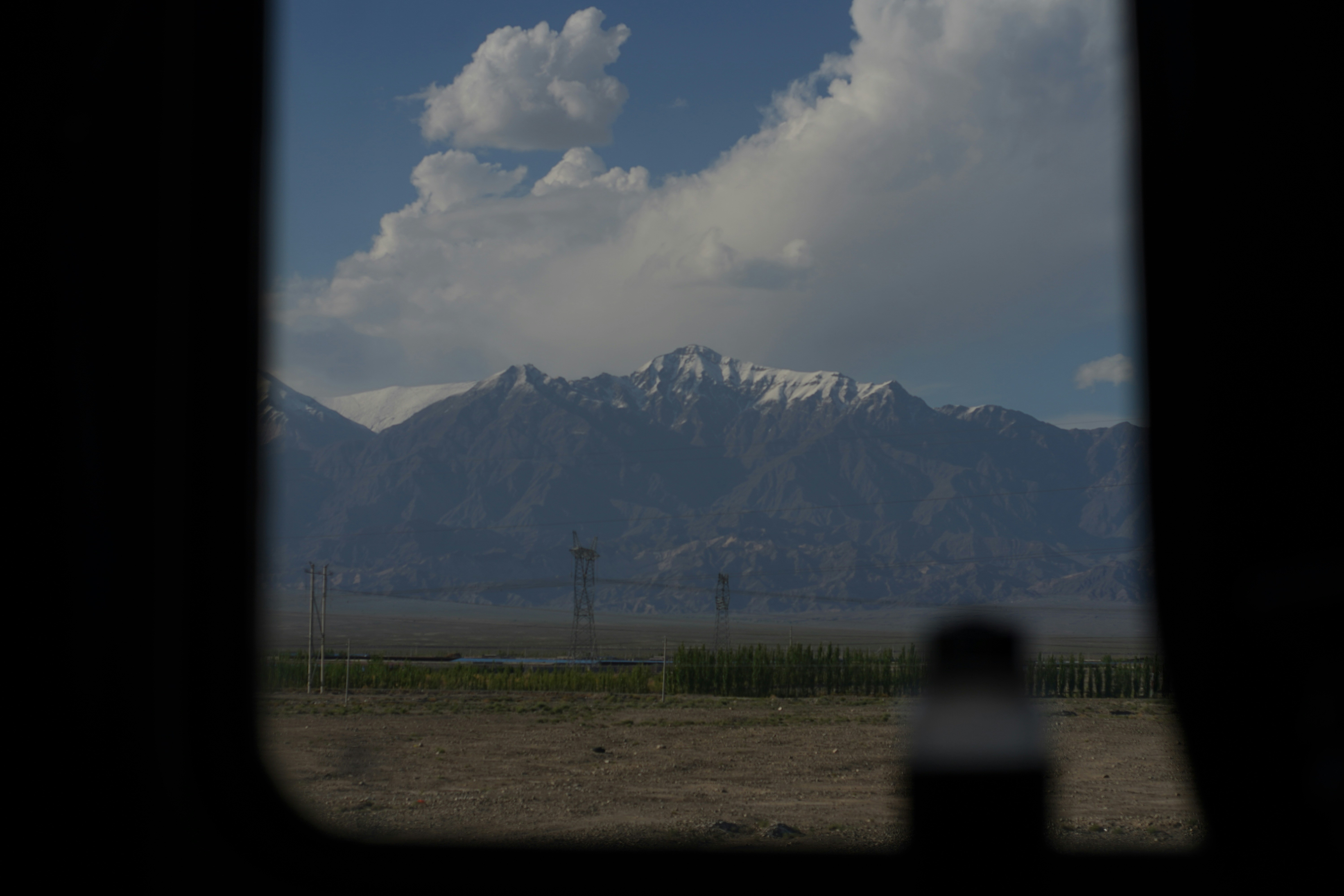 Remote Valley Overlook with Snow-Capped Range