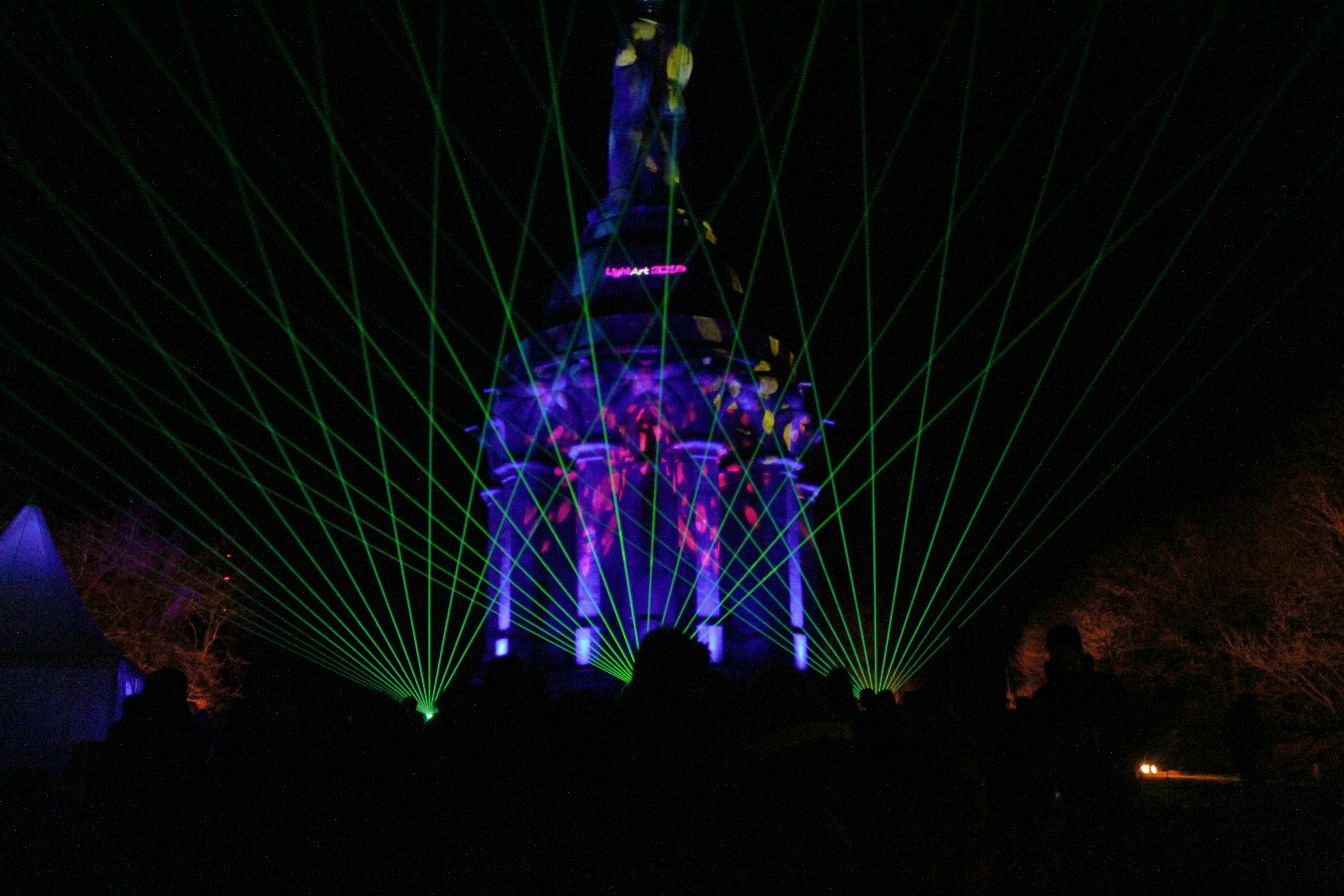 Green Laser Symphony Over a Silent Monument