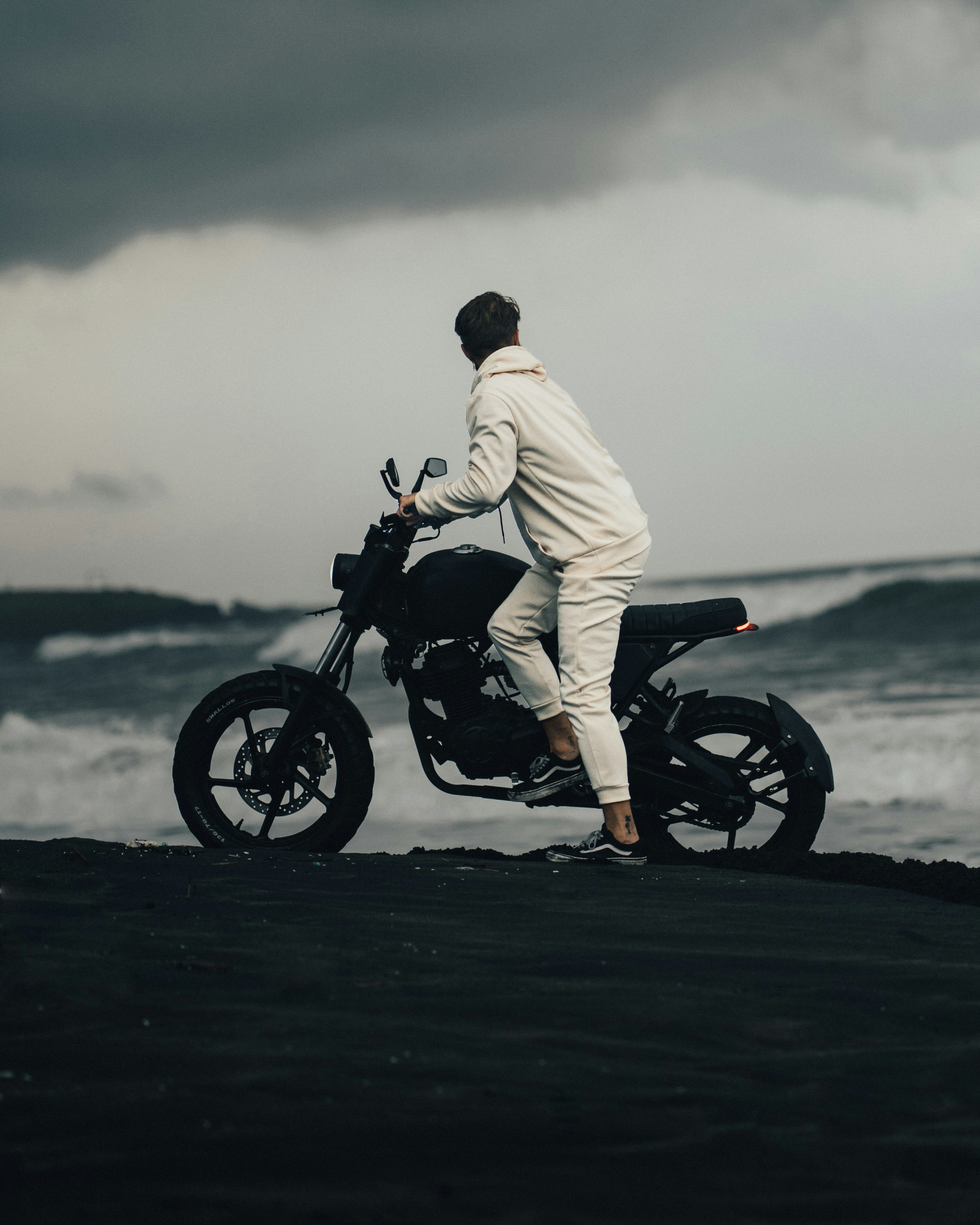Man in white robe riding black motorcycle photo – Free Grey Image on ...