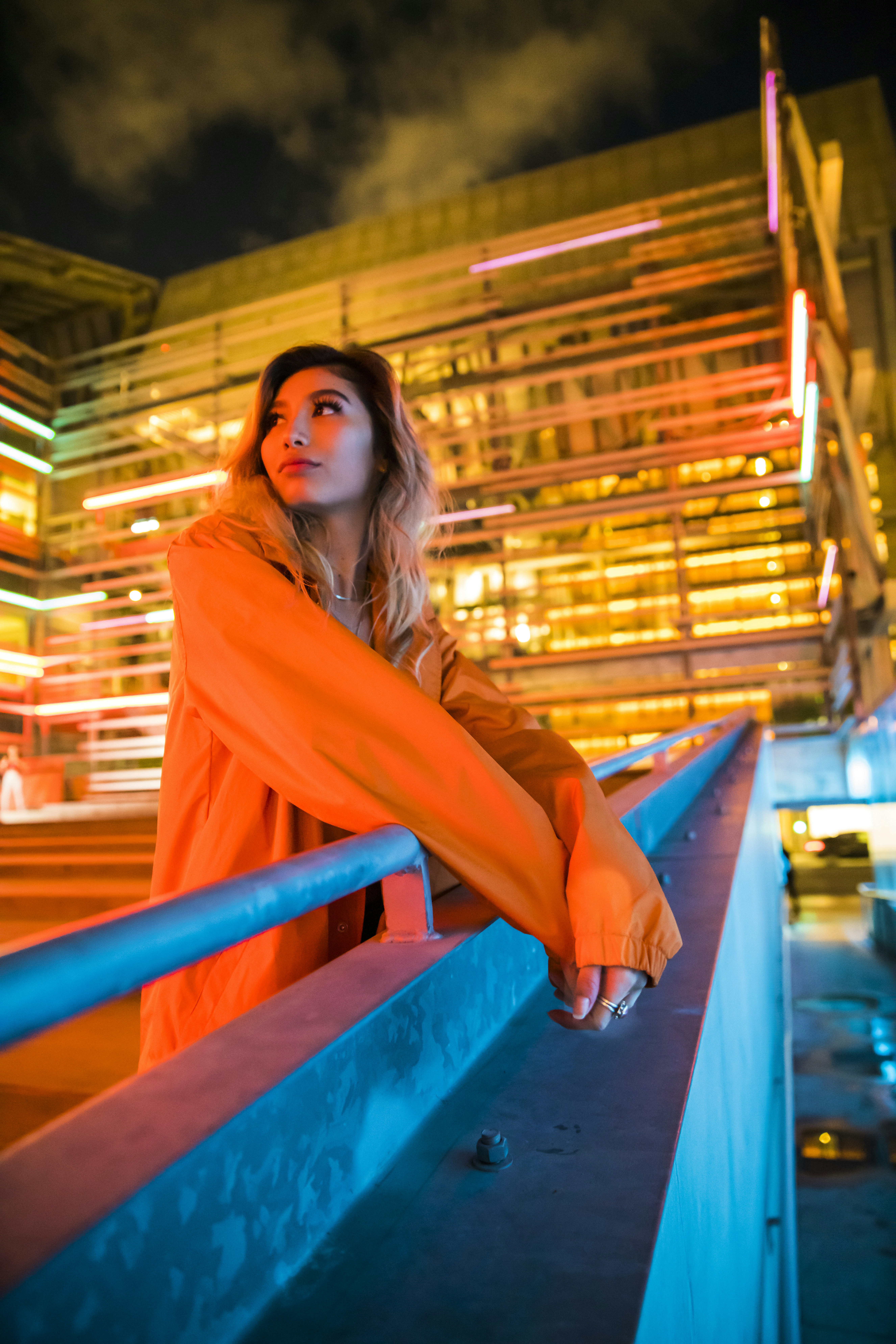 Neon Reflections: Night Portrait on the Blue Rails