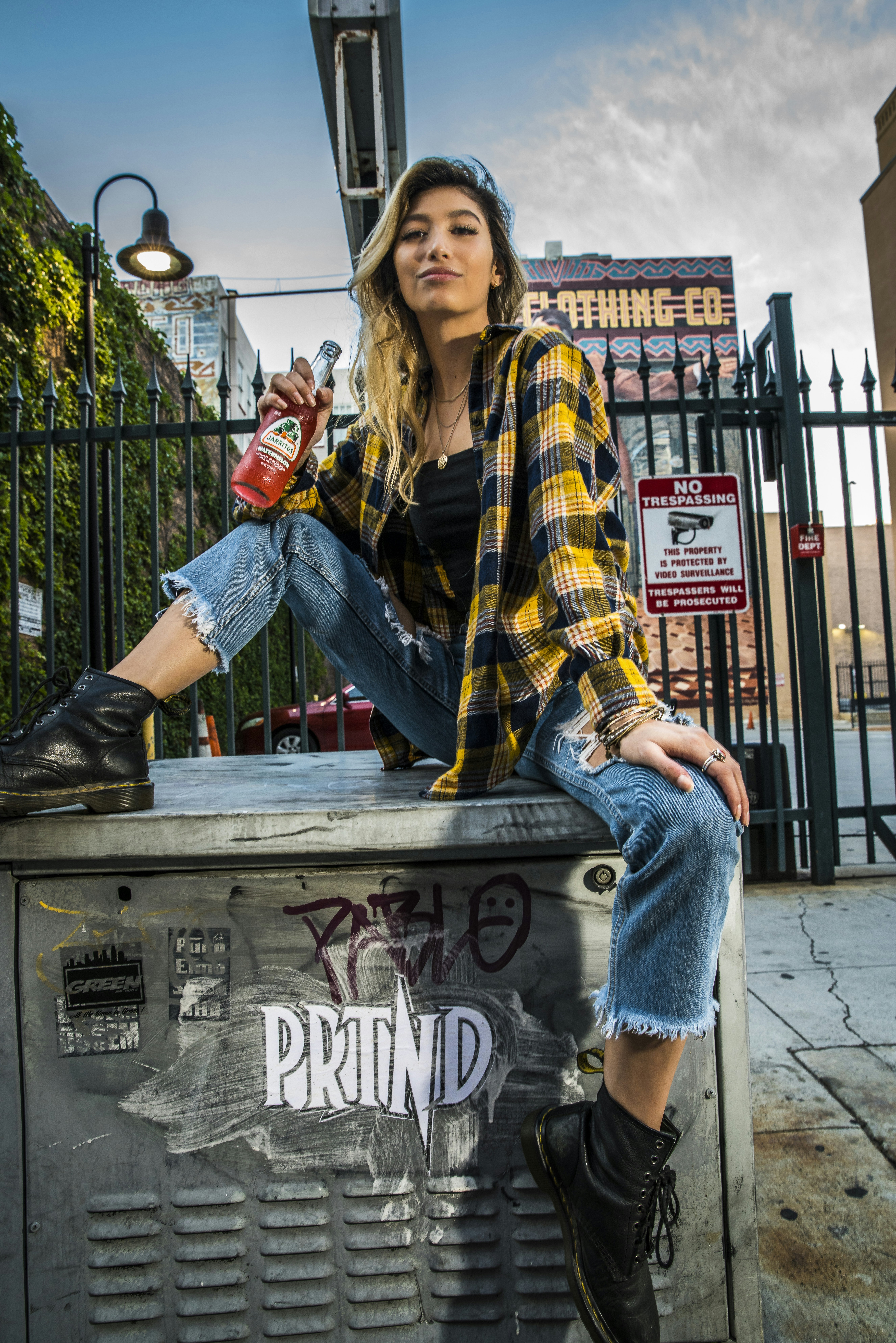 Urban Doppelgänger: A Riverside Moment with a Bottle