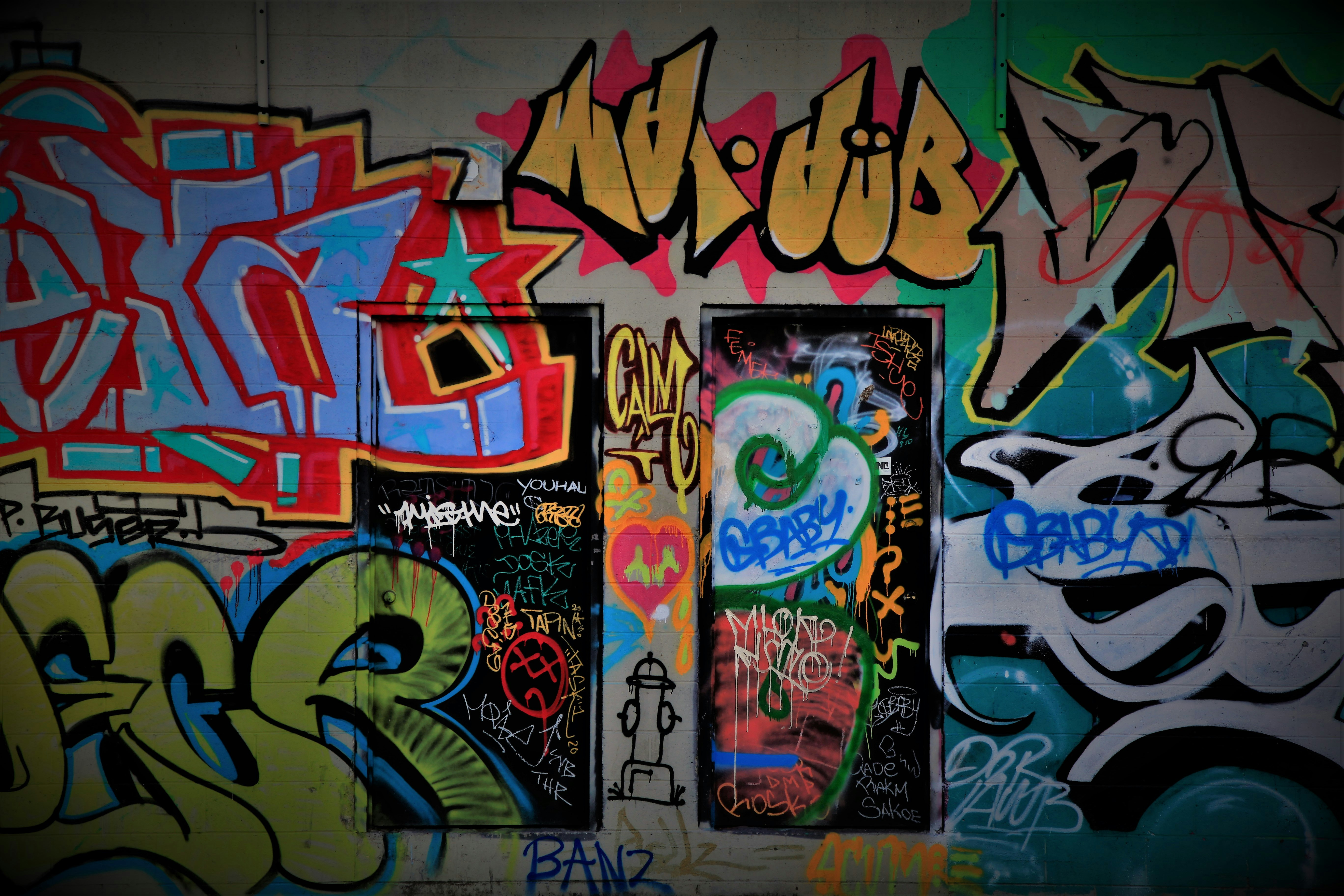 Red yellow and blue graffiti photo – Free Graffiti Image on Unsplash