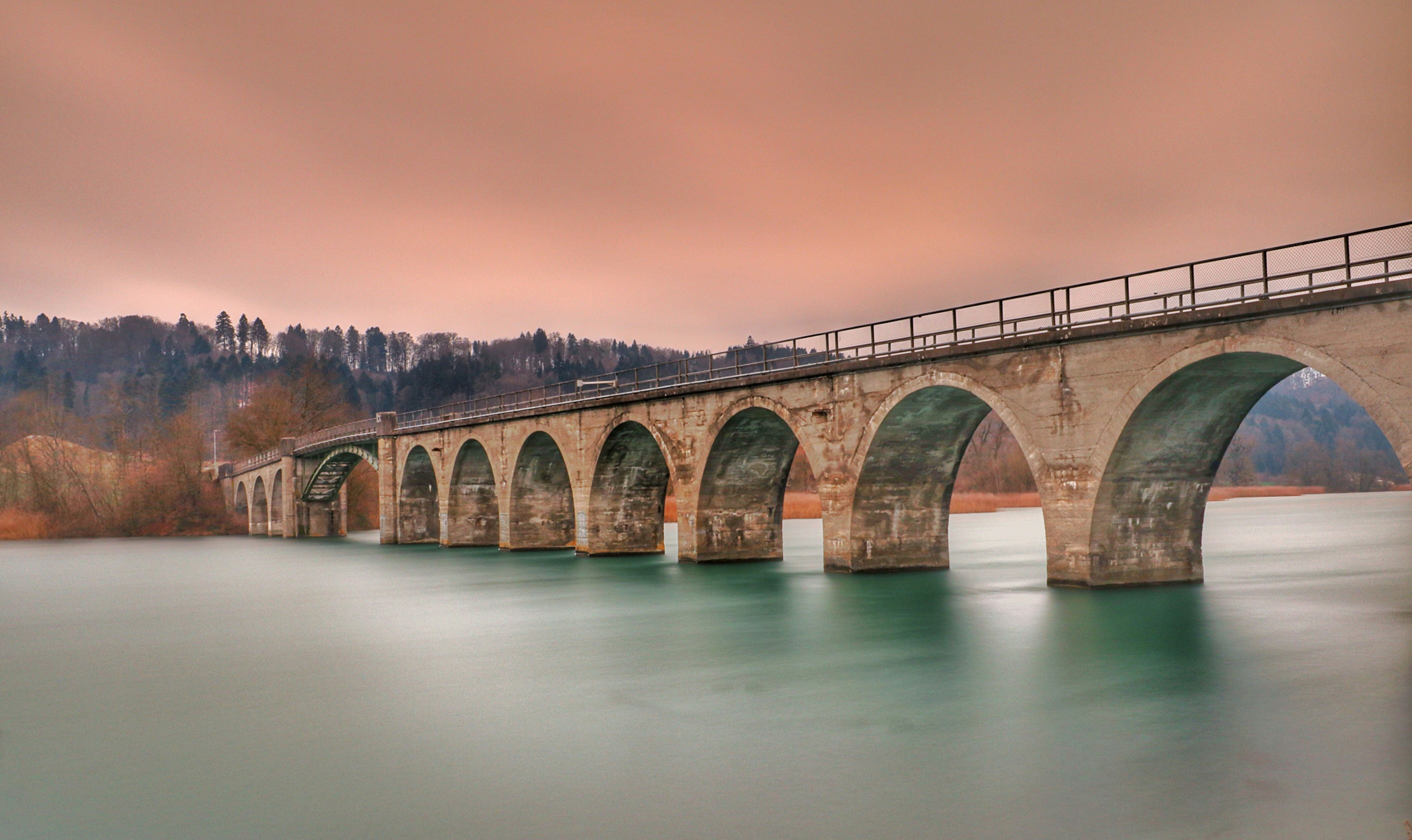 Stone Arc Symphony Over Quiet Waters