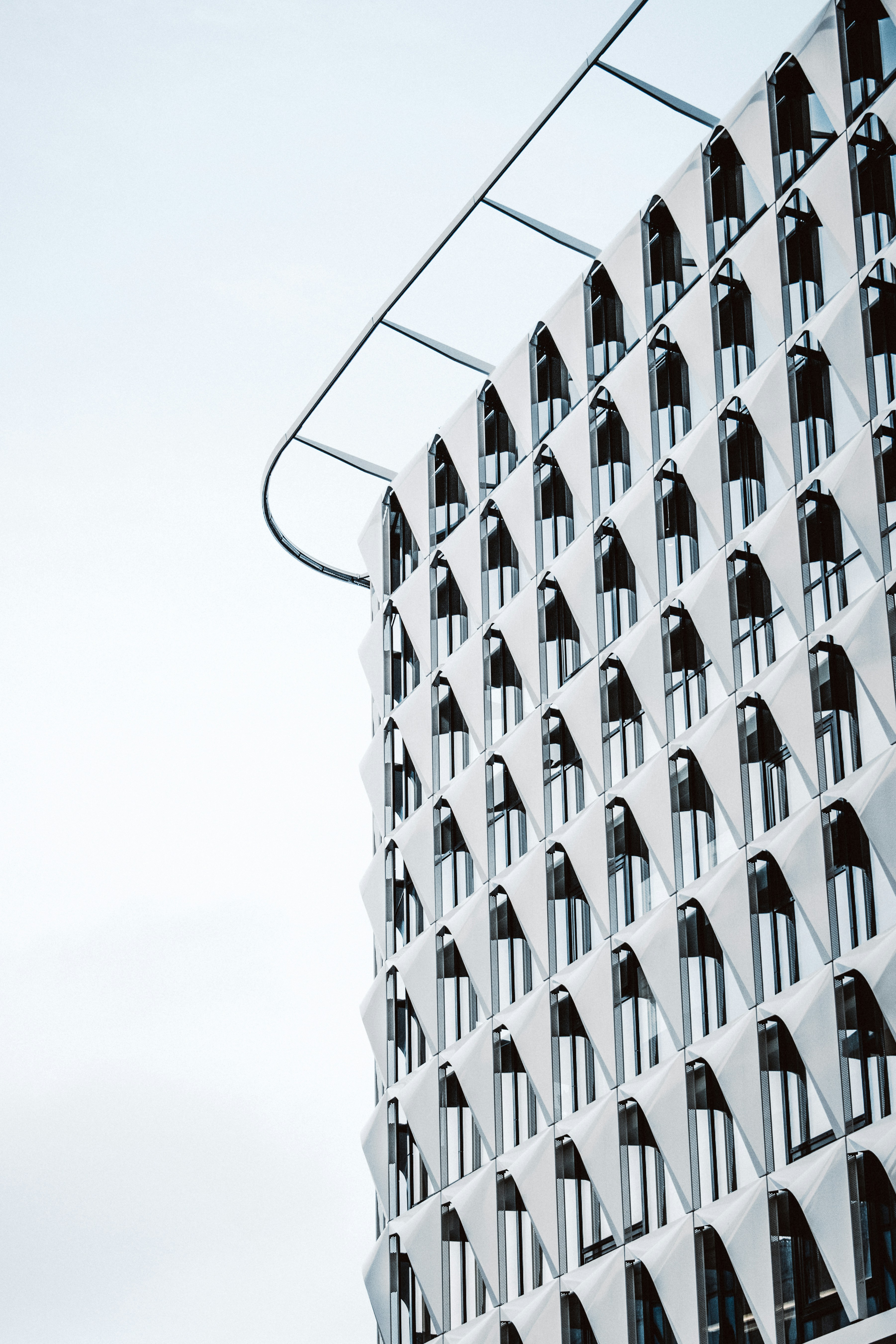 Tilted Rhythm: Diamonds of Light on a Modern Facade