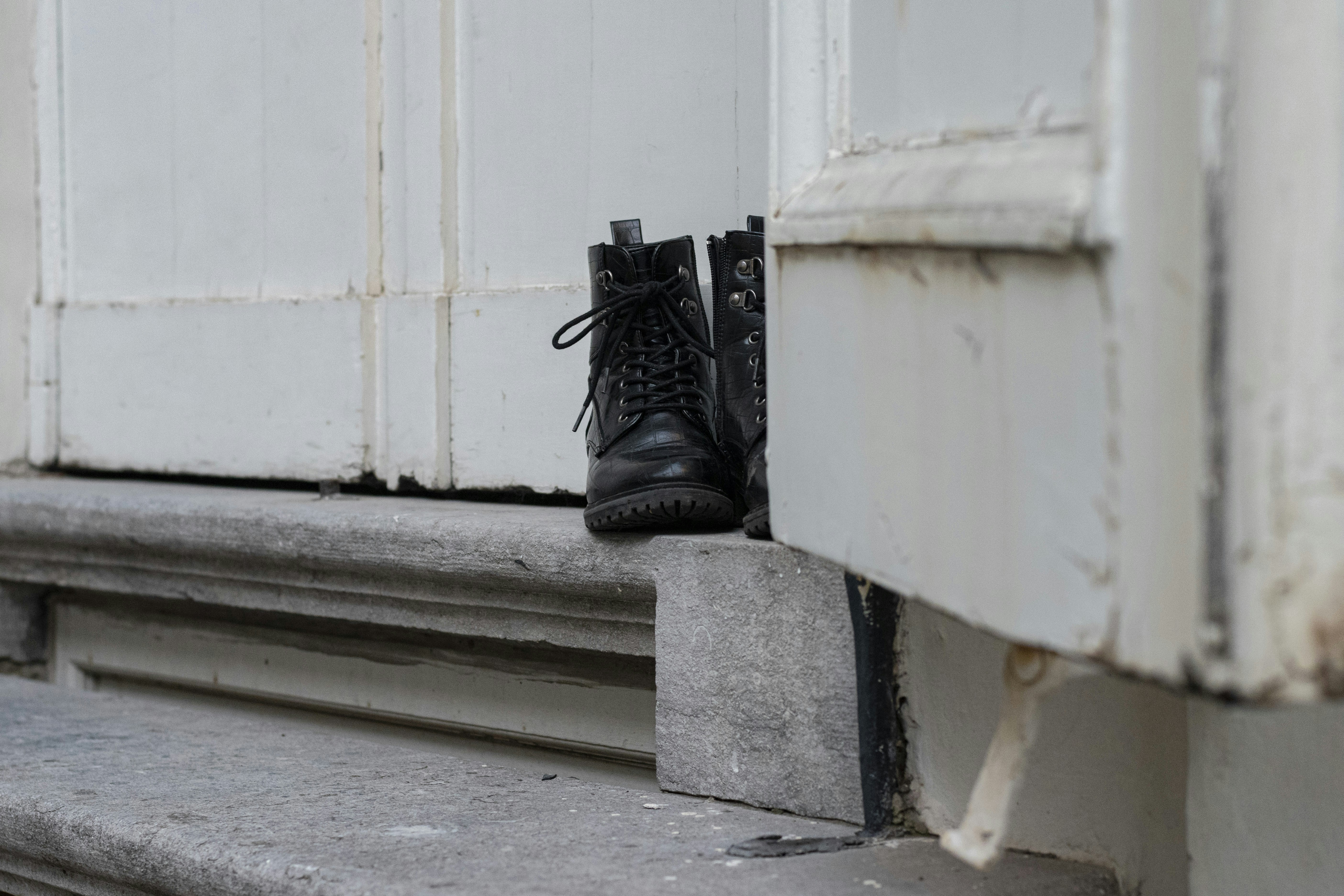 Boots at the Threshold: A Quiet Step into Abandoned Daylight