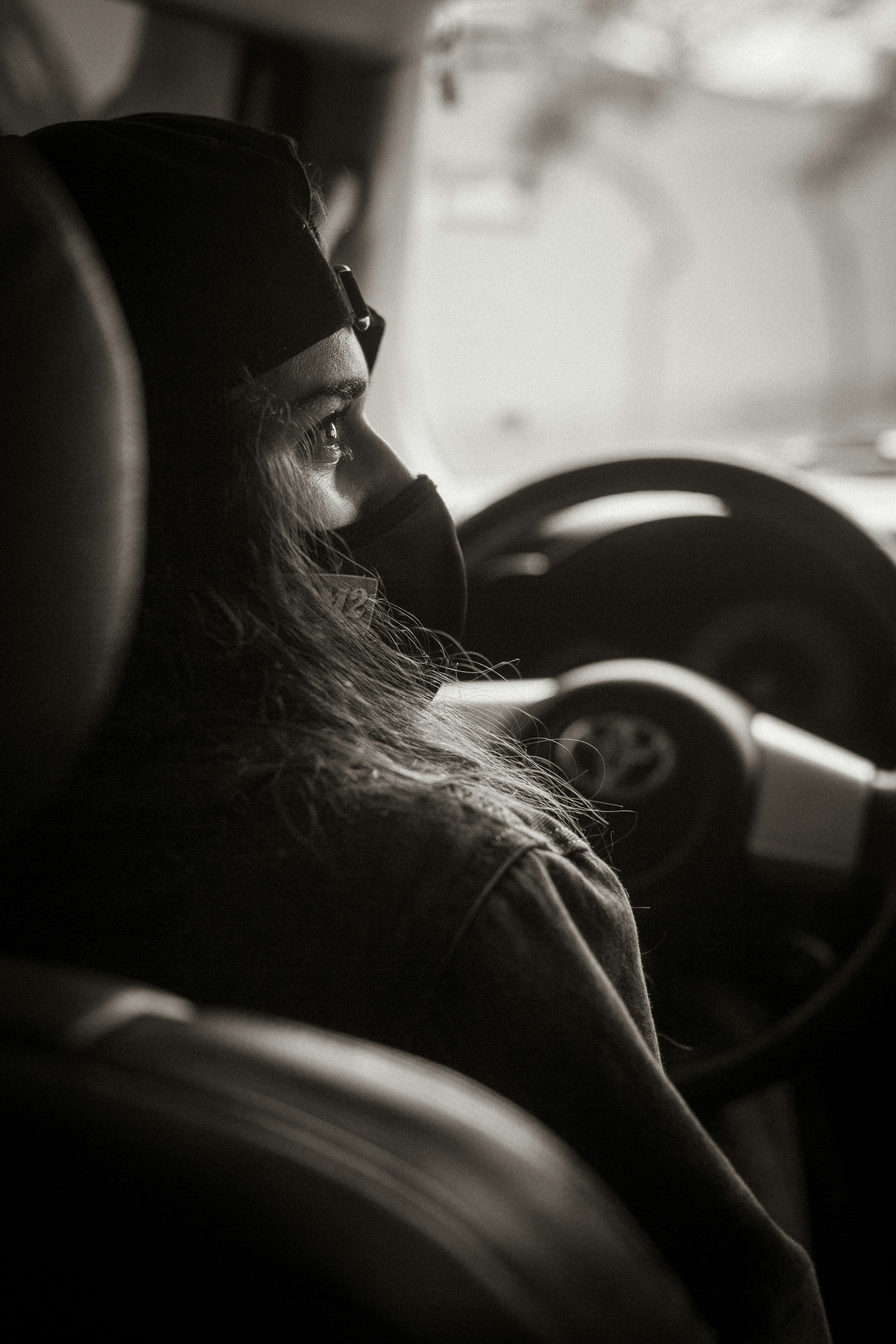 Glimmer in the Sepia Cabin: A Quiet Driver’s Gaze