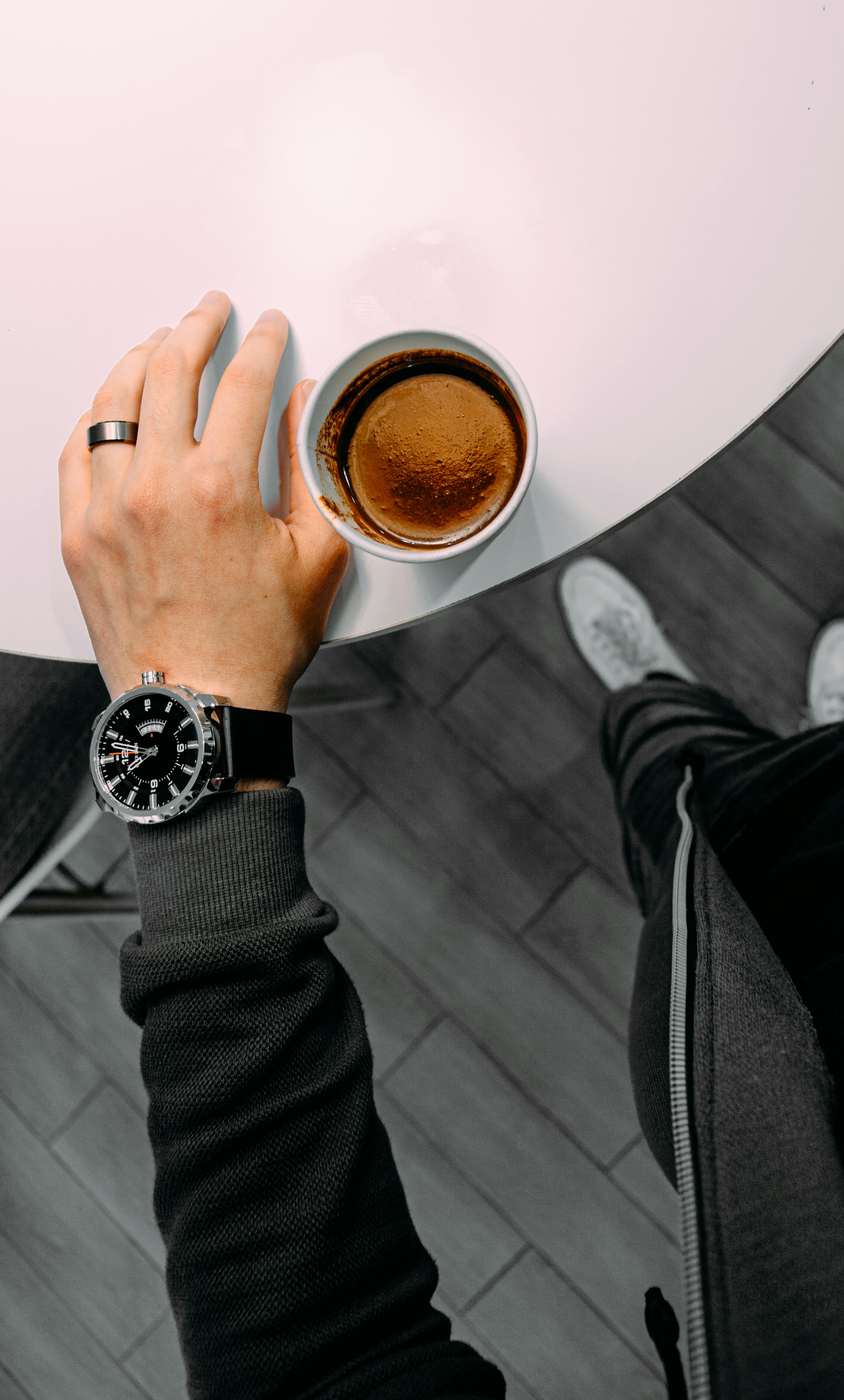 Clockwork Coffee Break: A Wristwatch, a Cup, and Morning Calm